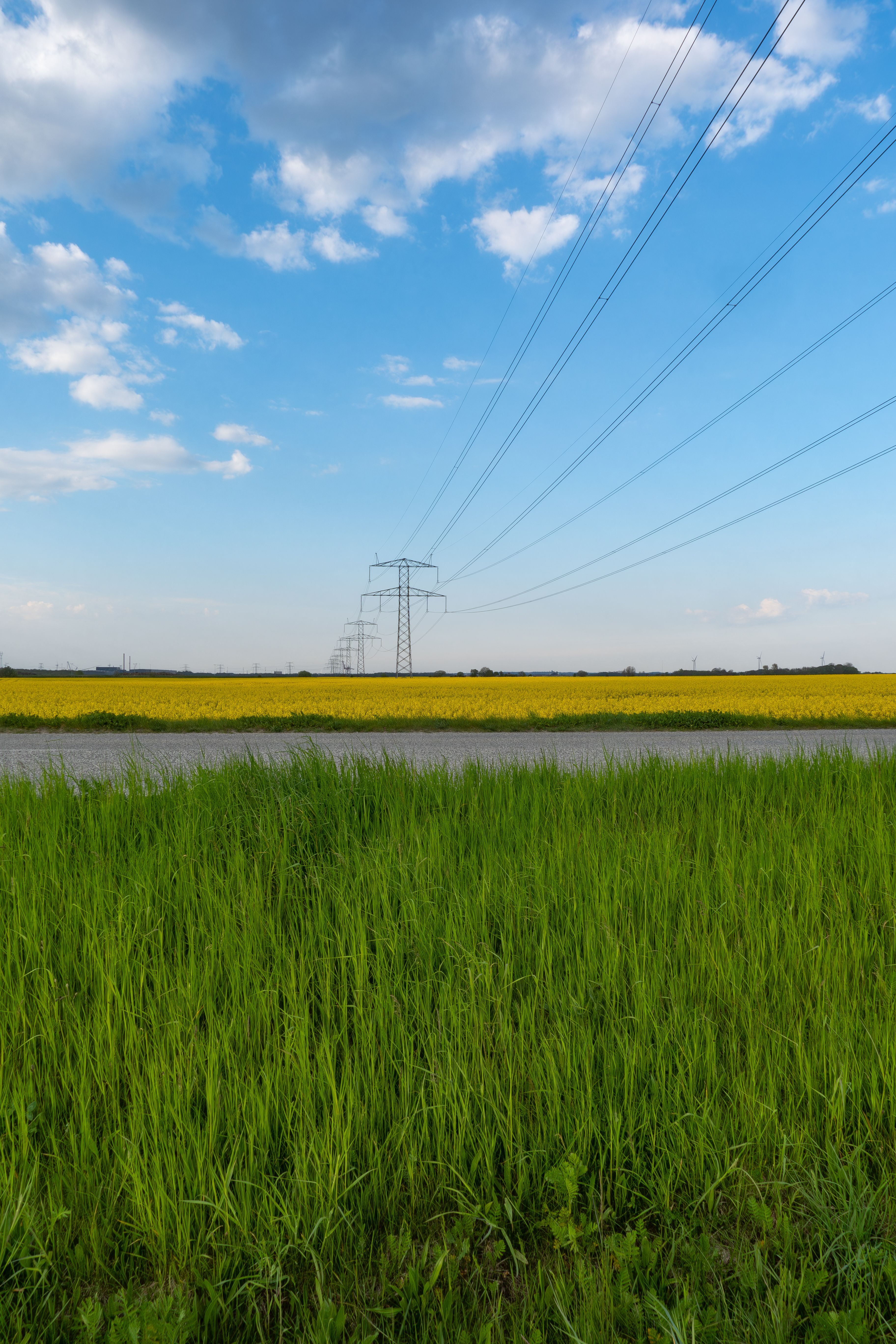 Power Lines over Fields and Road in Countryside · Free Stock Photo