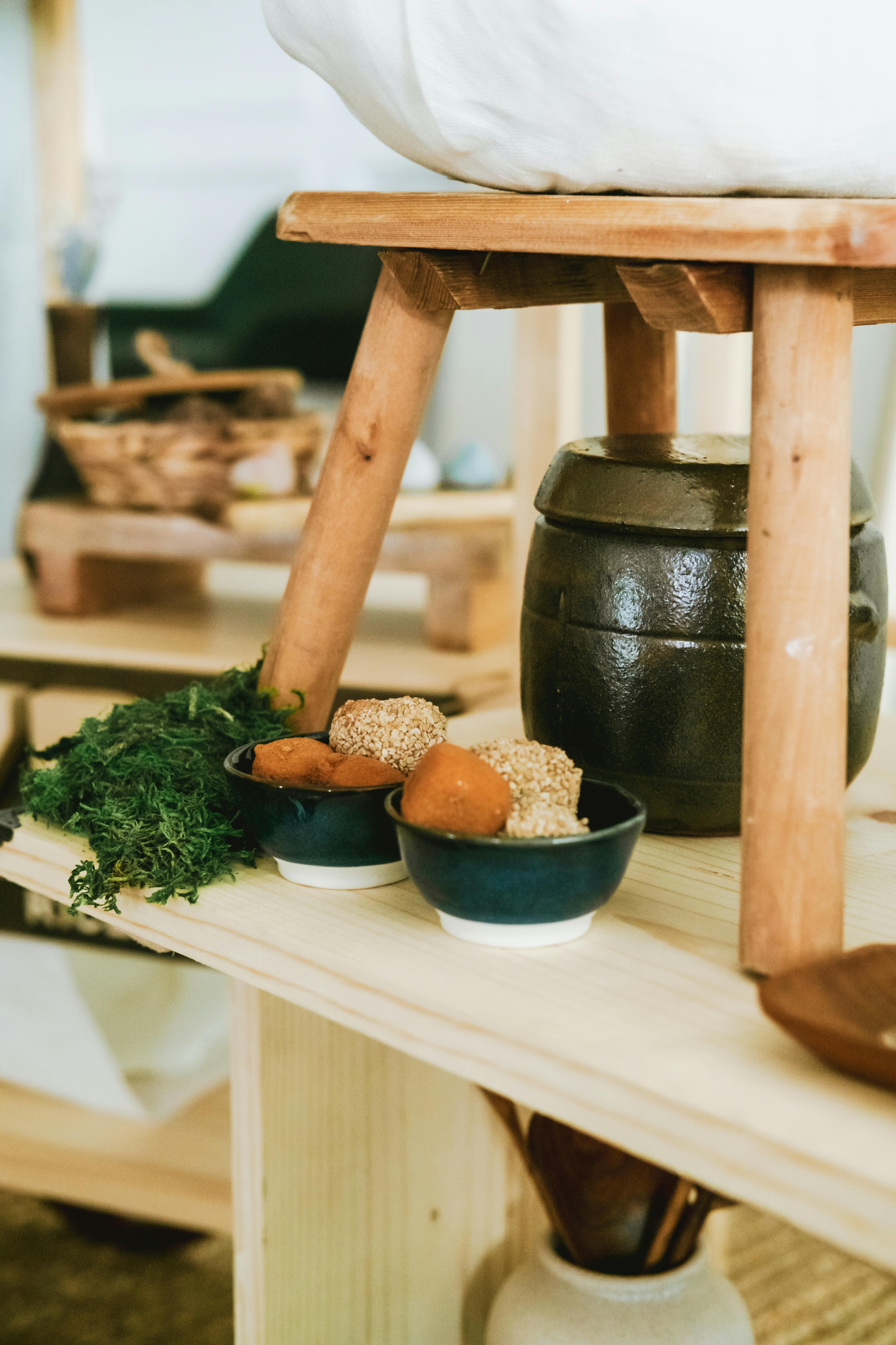 Food in Bowls under Chair on Table · Free Stock Photo