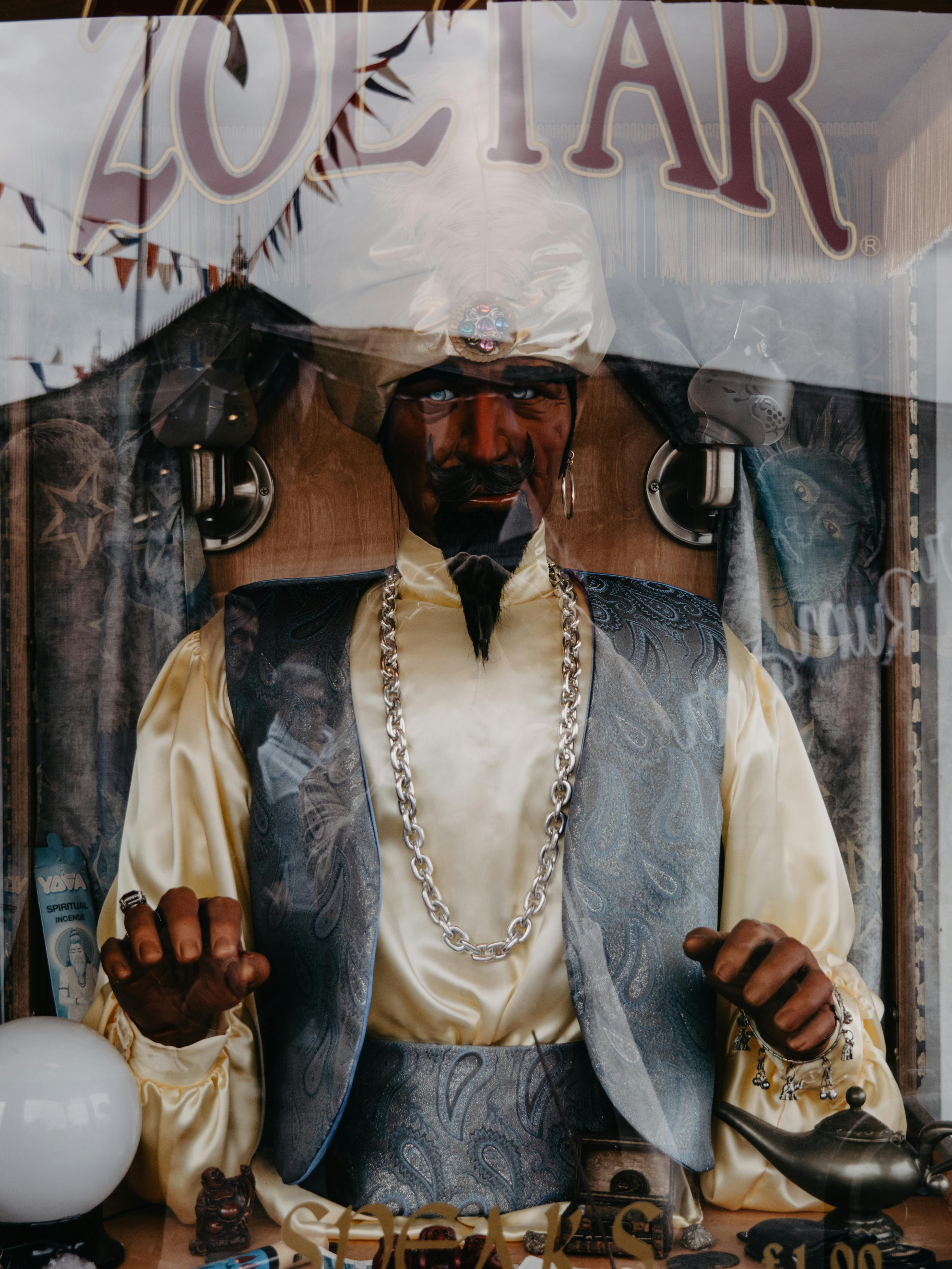 Figure of Fortune Teller Man in Storefront Window · Free Stock Photo