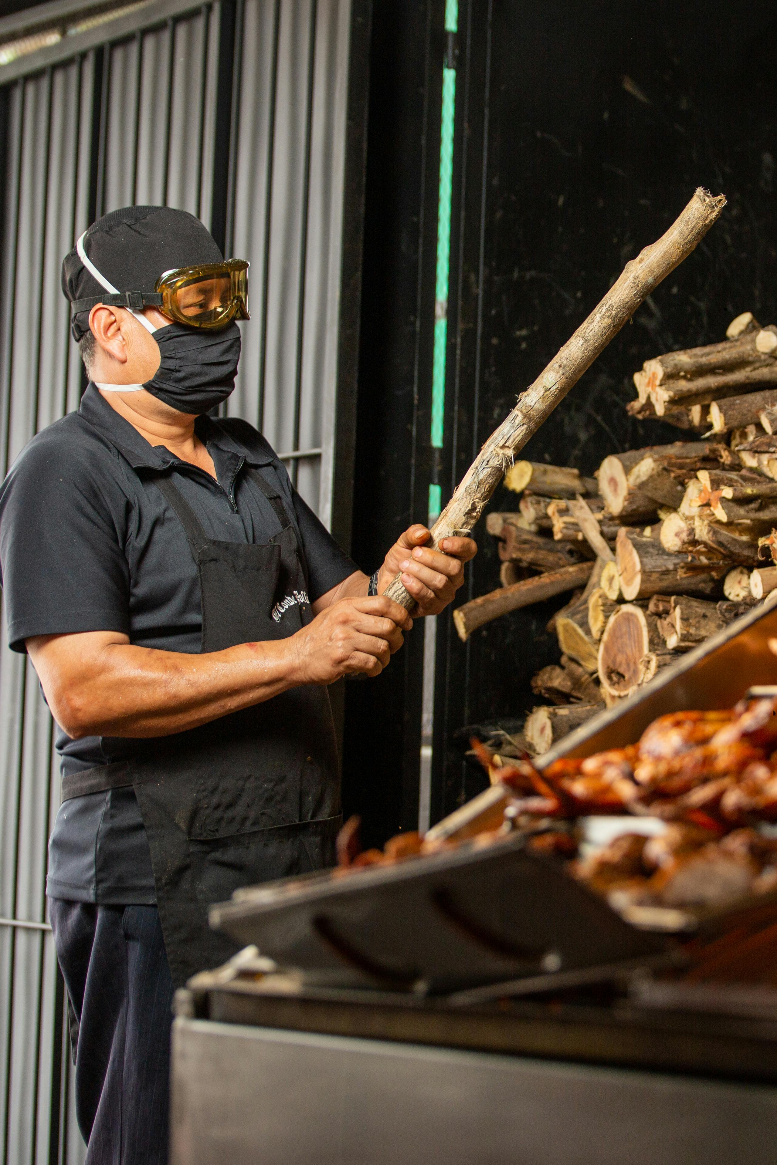 Photography of Man Cooking Surrounded by Woks · Free Stock Photo