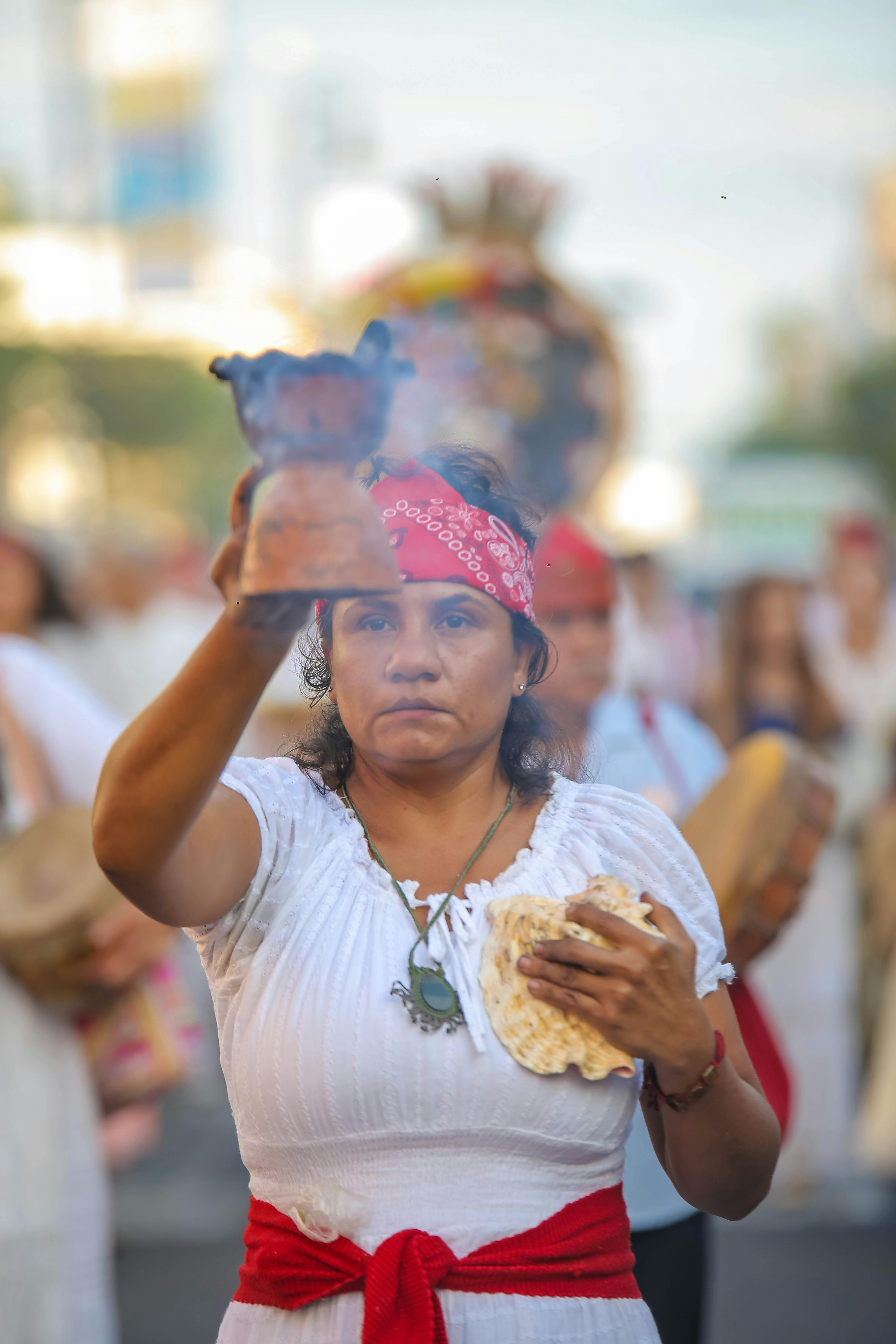 Aztec Woman Holding up Brass Vessel Emitting Smoke · Free Stock Photo