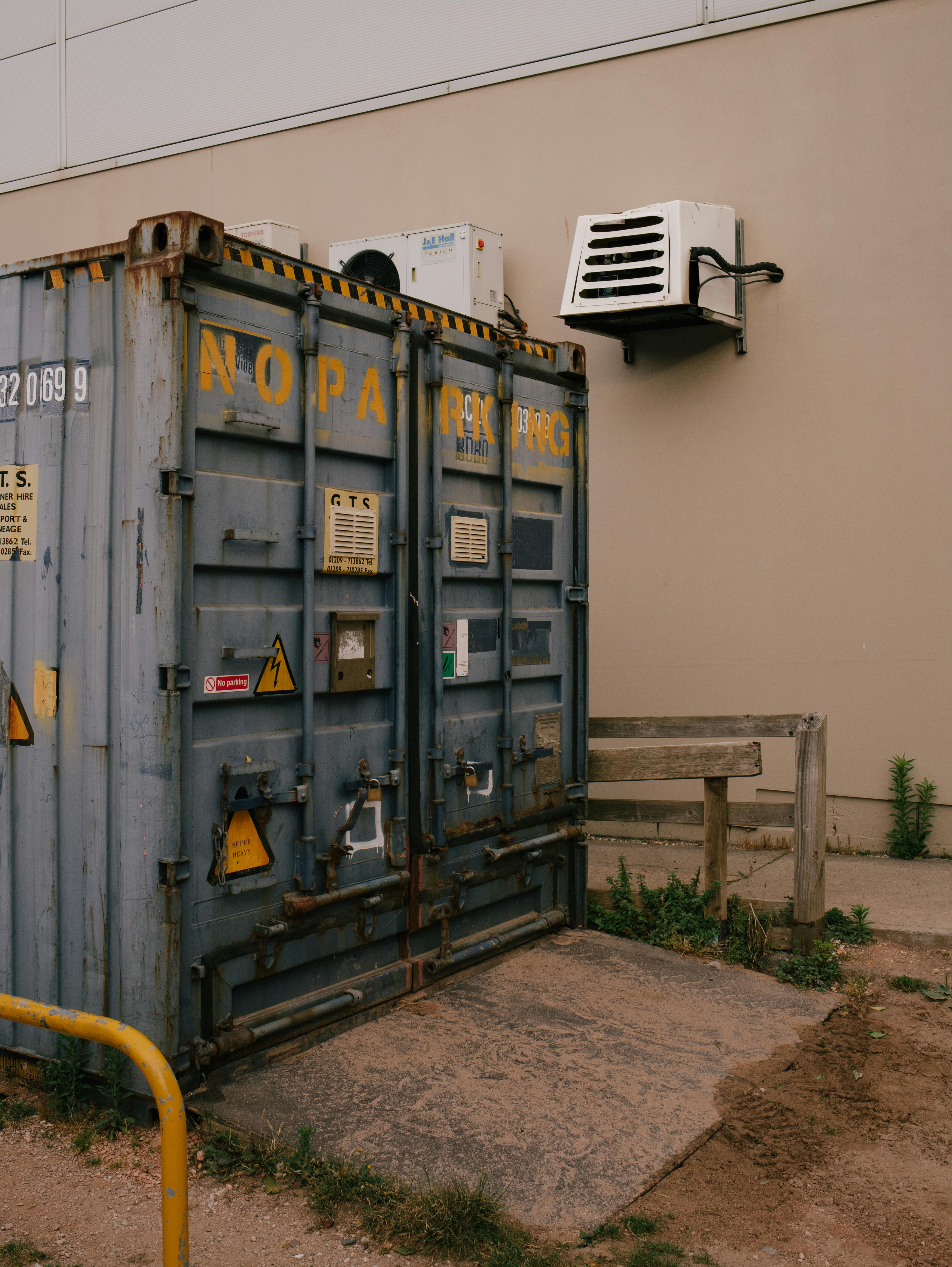 Transformer Substation behind Building · Free Stock Photo