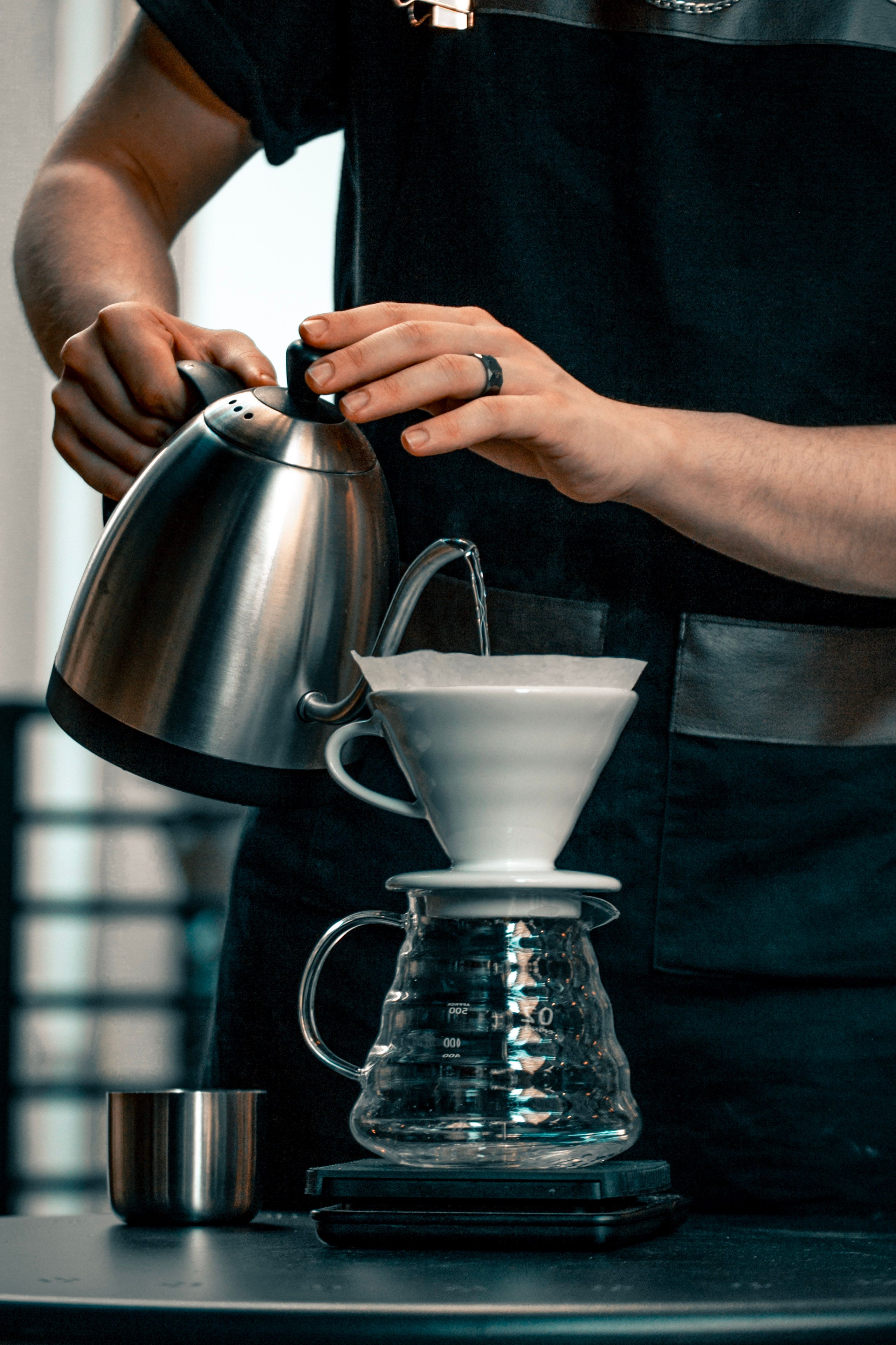Pouring Boiling Water into the Pour-over Coffee Maker · Free Stock Photo