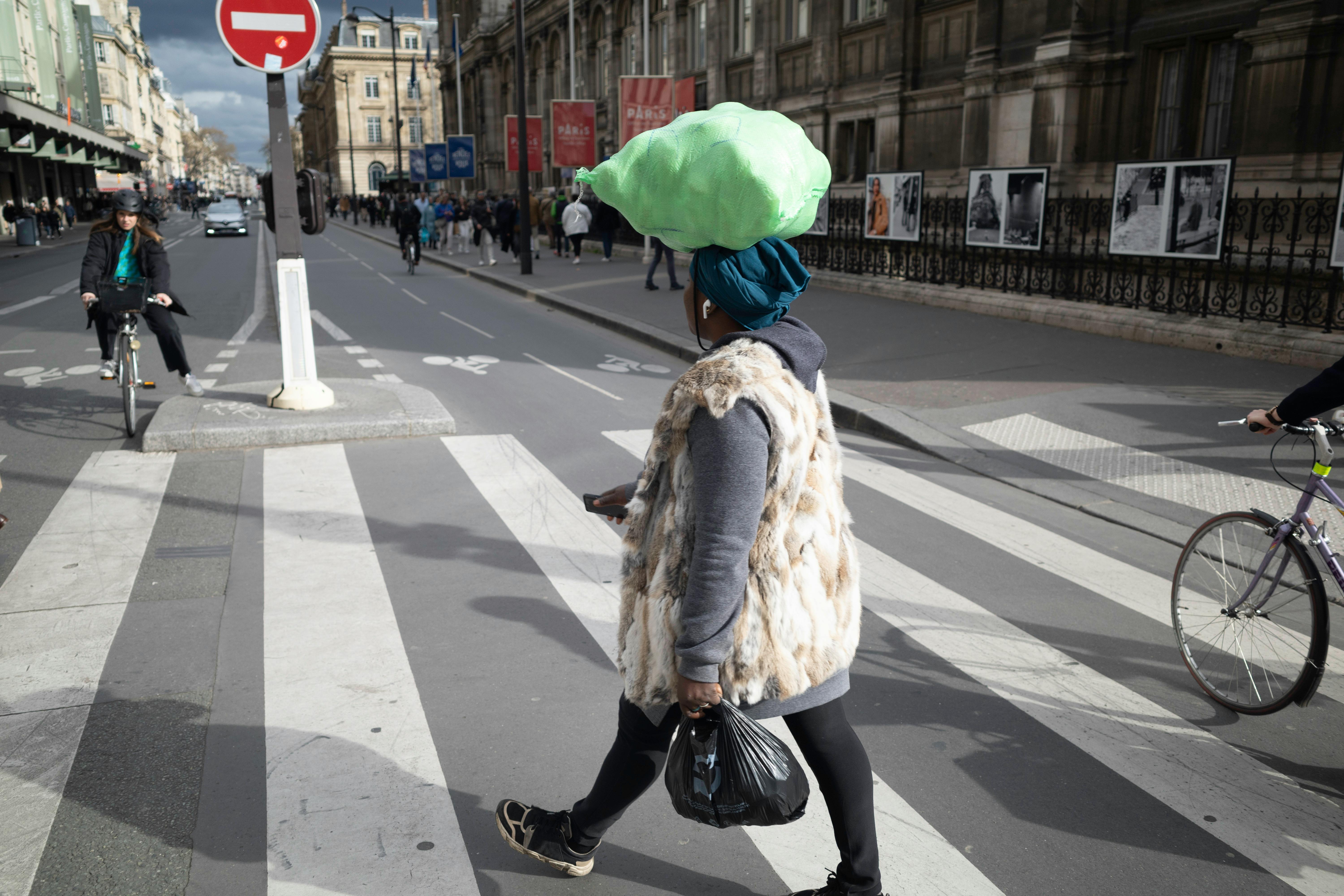 Woman Carrying Bag on Head on Zebra Crossing · Free Stock Photo
