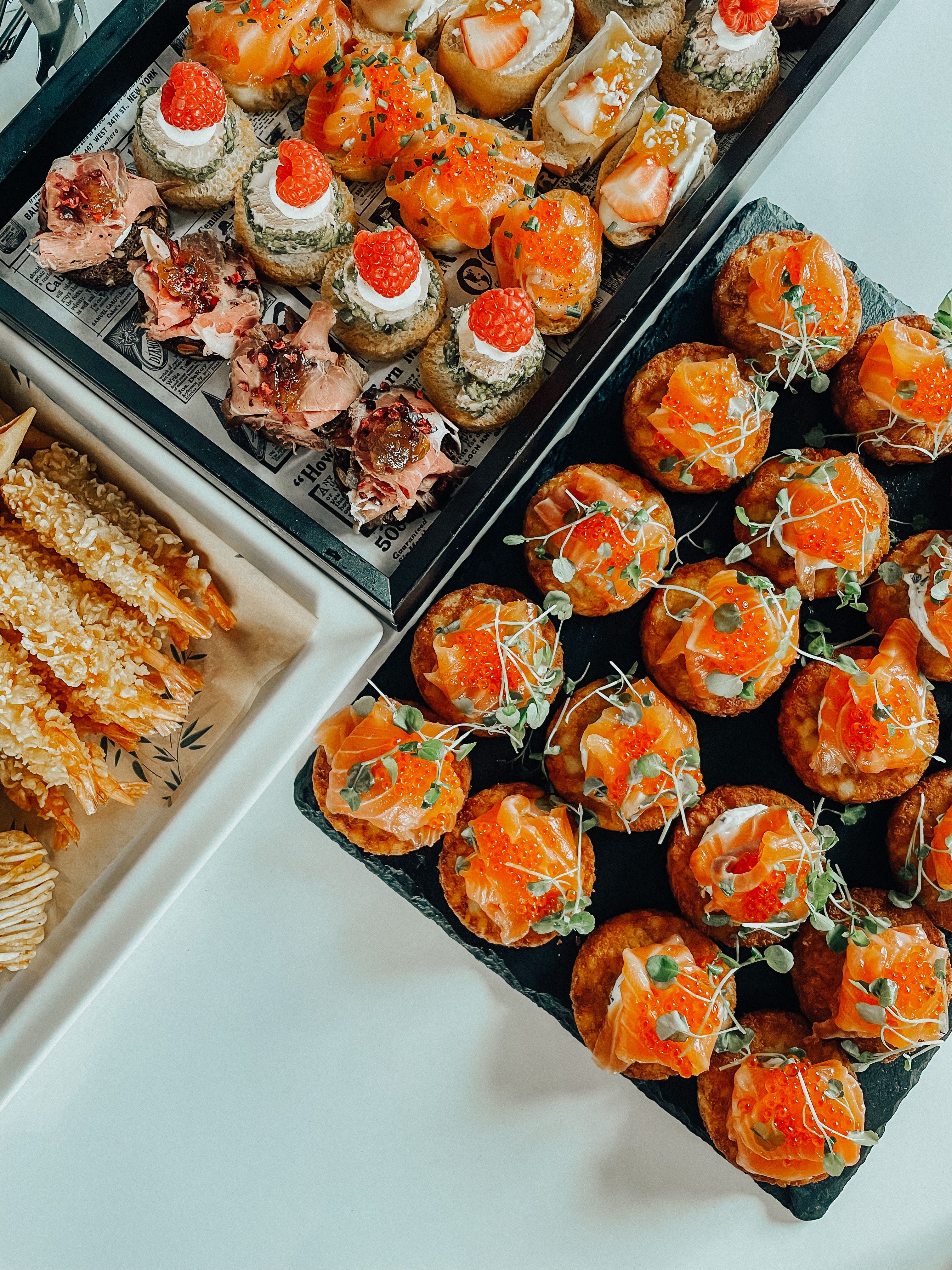 Delicious Snacks on Trays on Table · Free Stock Photo