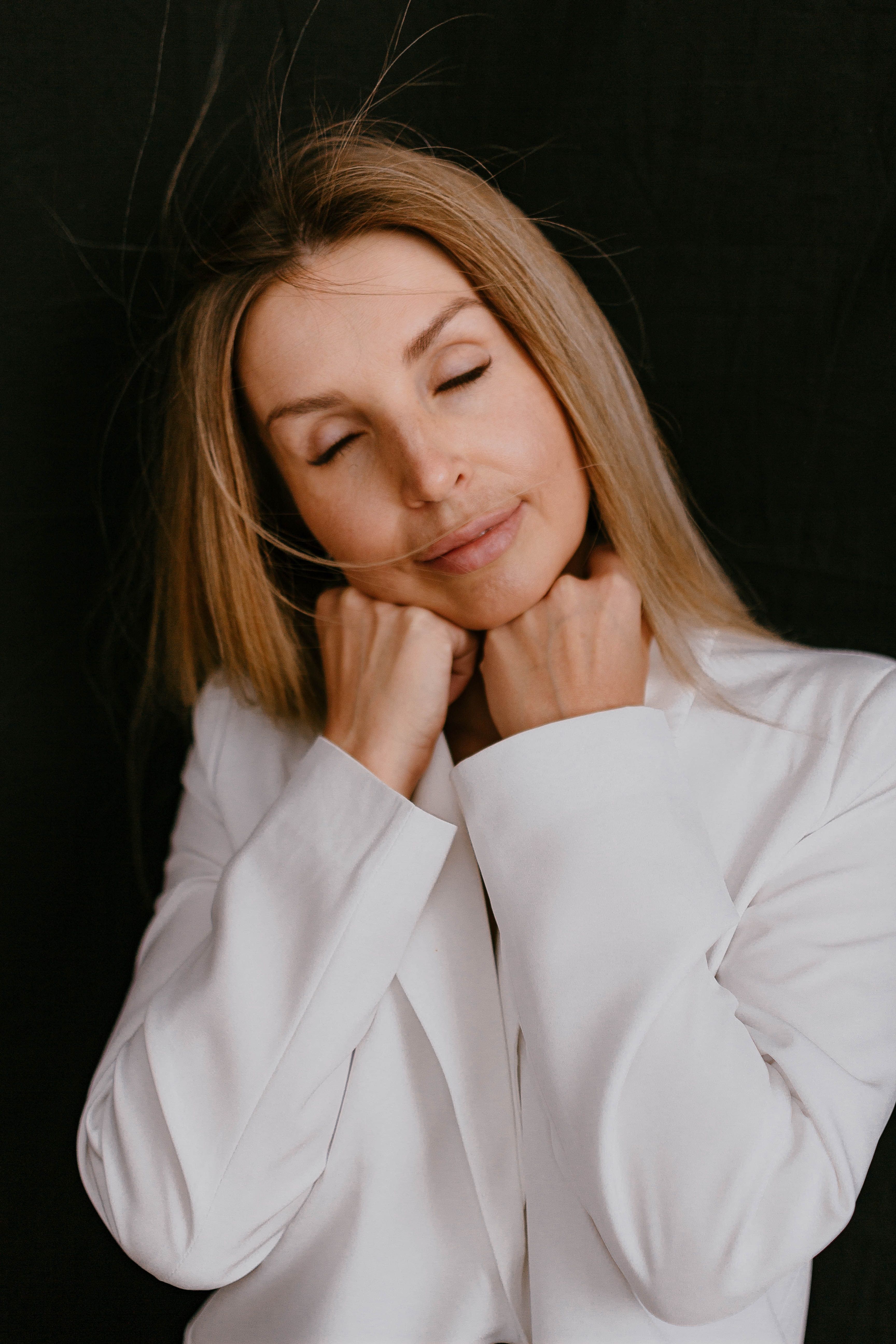 Woman Standing in White Suit · Free Stock Photo
