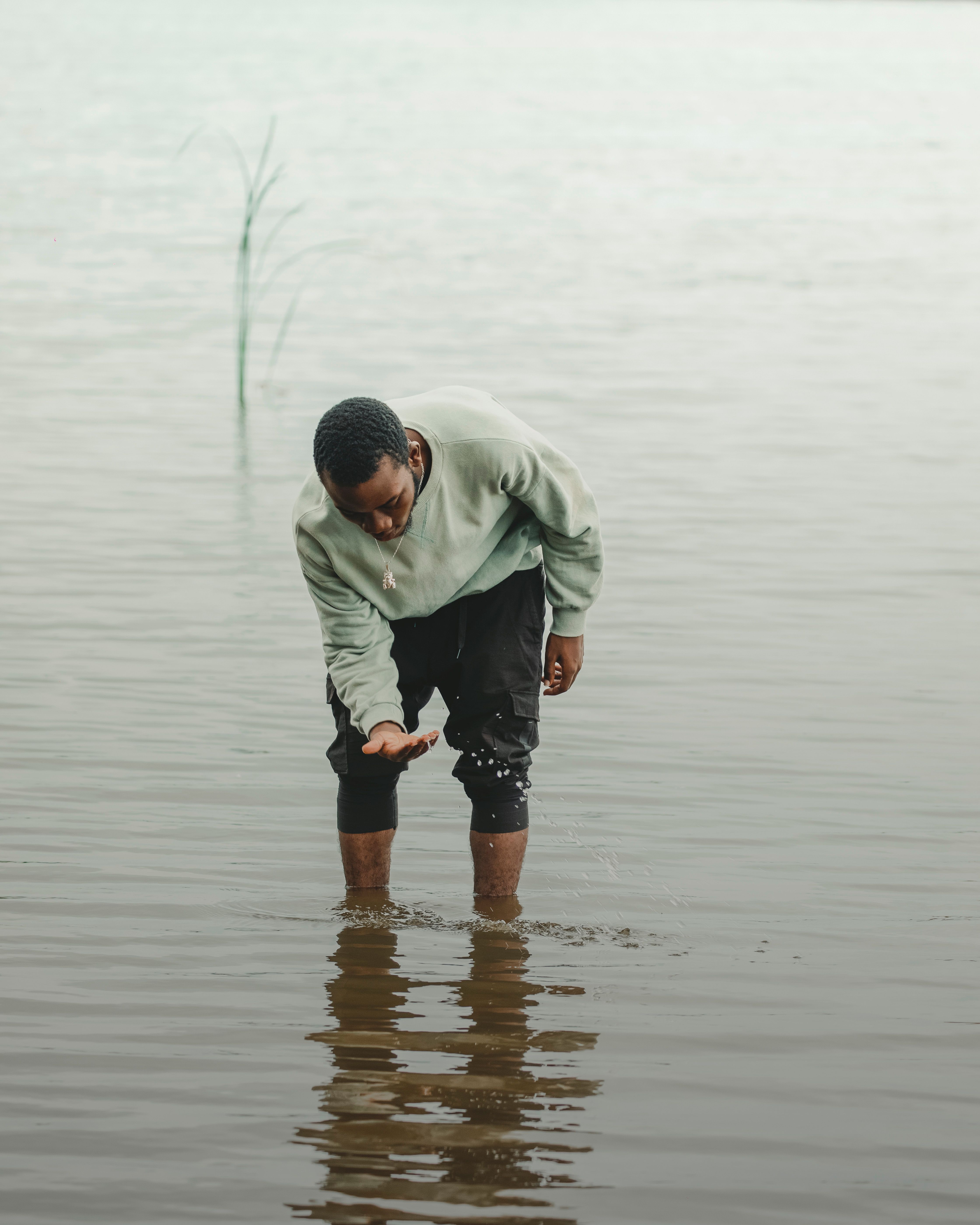 A Man Standing in Water · Free Stock Photo