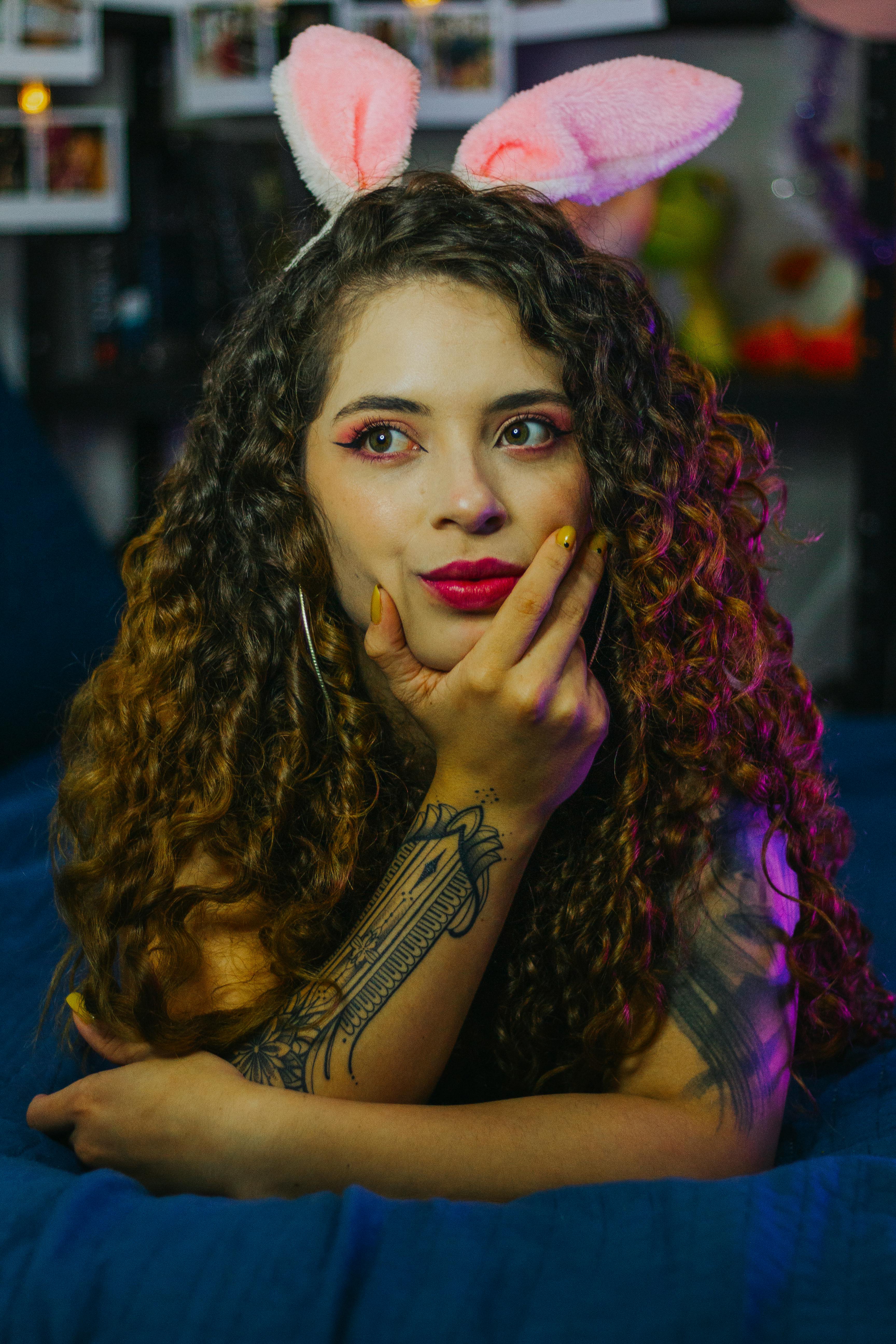 Woman with Rabbit Ears and Curly Hair · Free Stock Photo