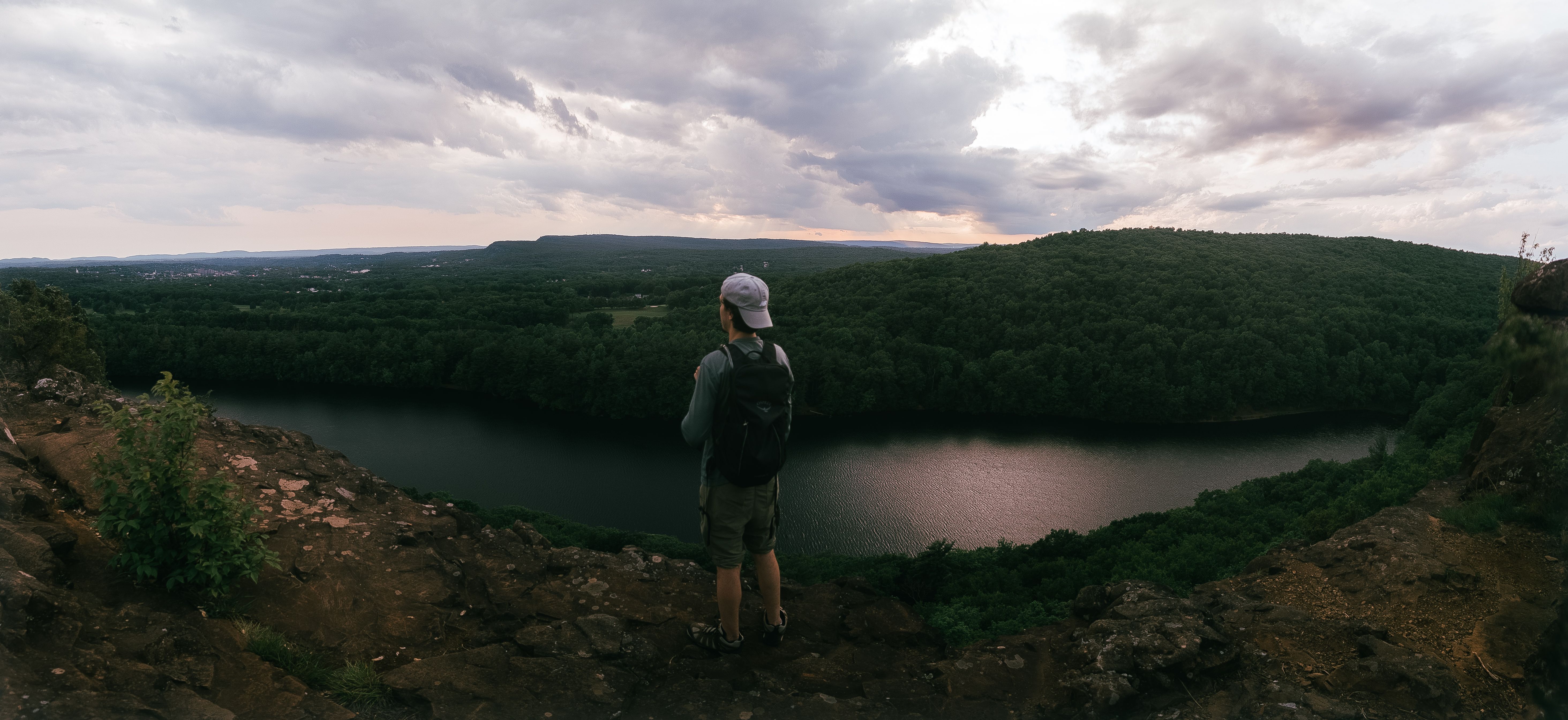 Man Standing on Hill over River · Free Stock Photo