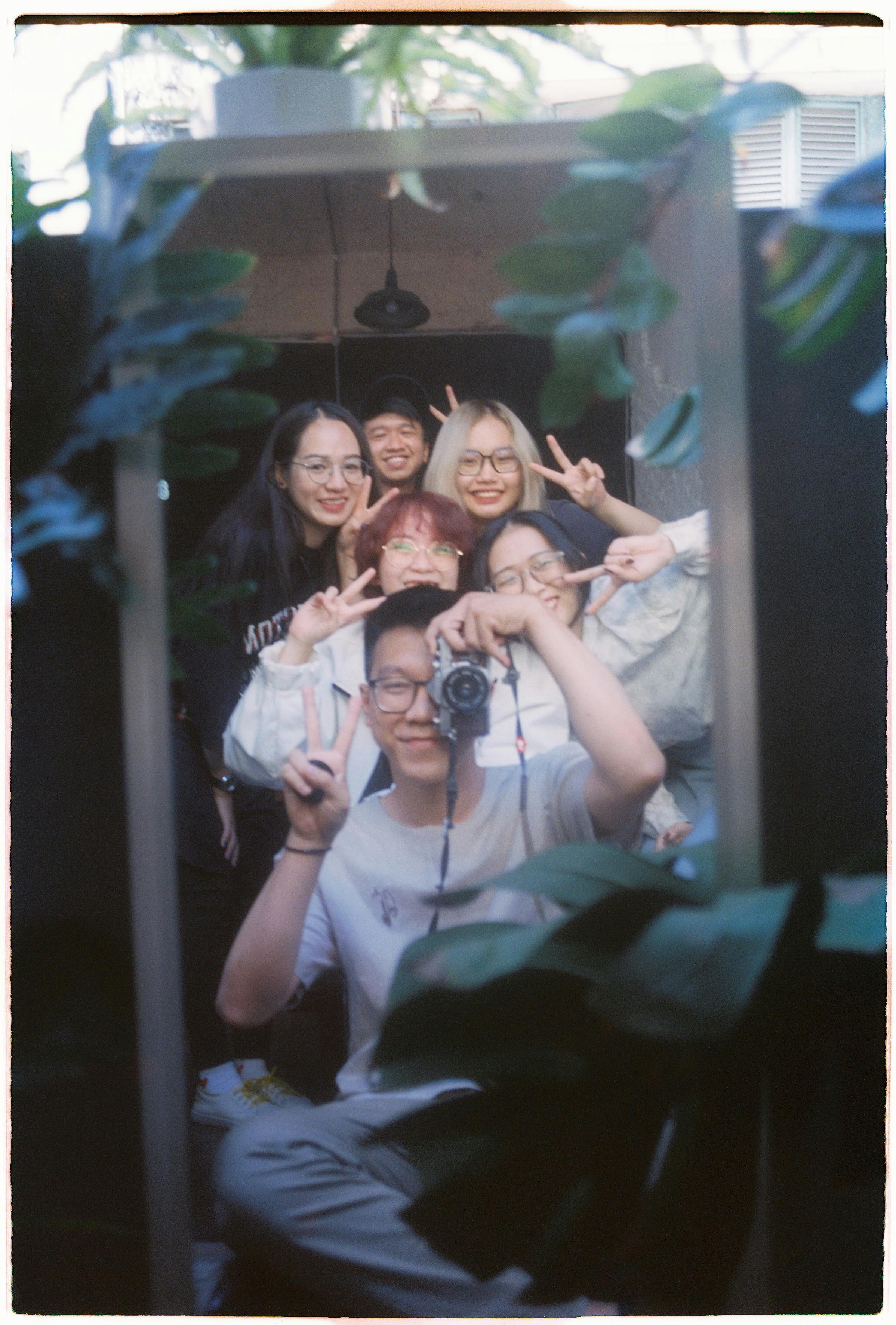 Reflection of a Group of People in a Mirror · Free Stock Photo