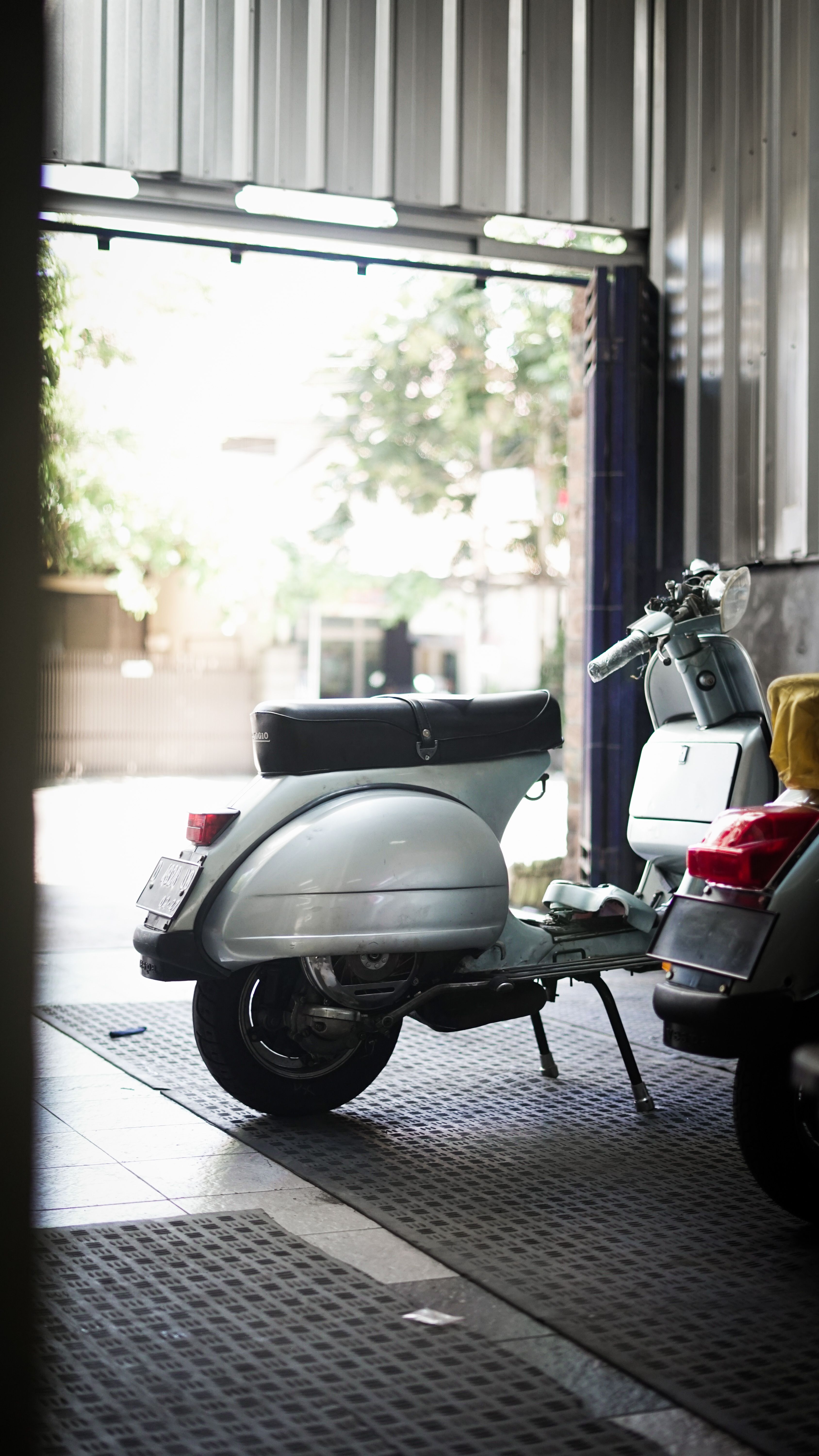 A Scooter in a Garage · Free Stock Photo