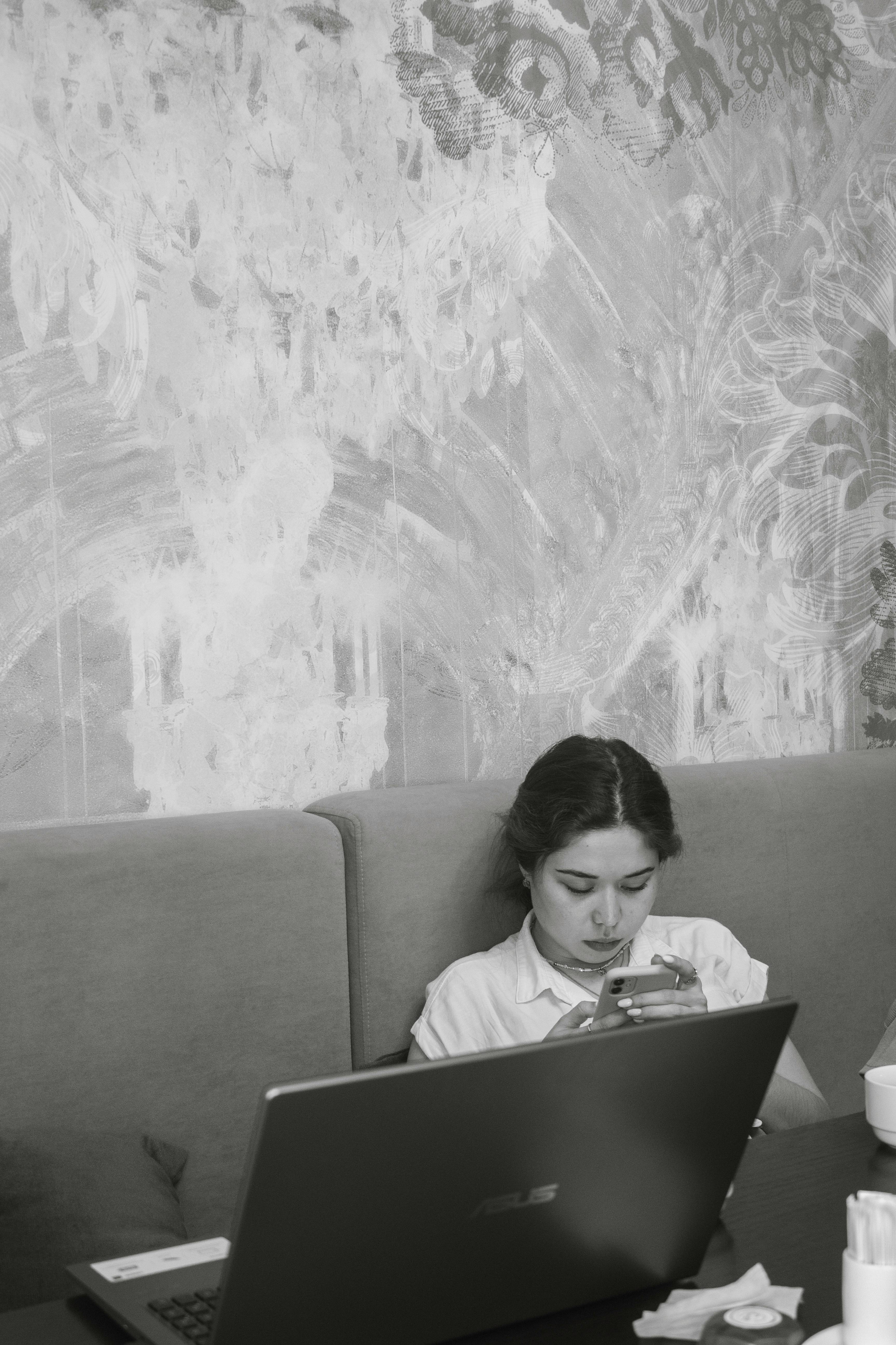 Sitting Woman behind Laptop on Table · Free Stock Photo