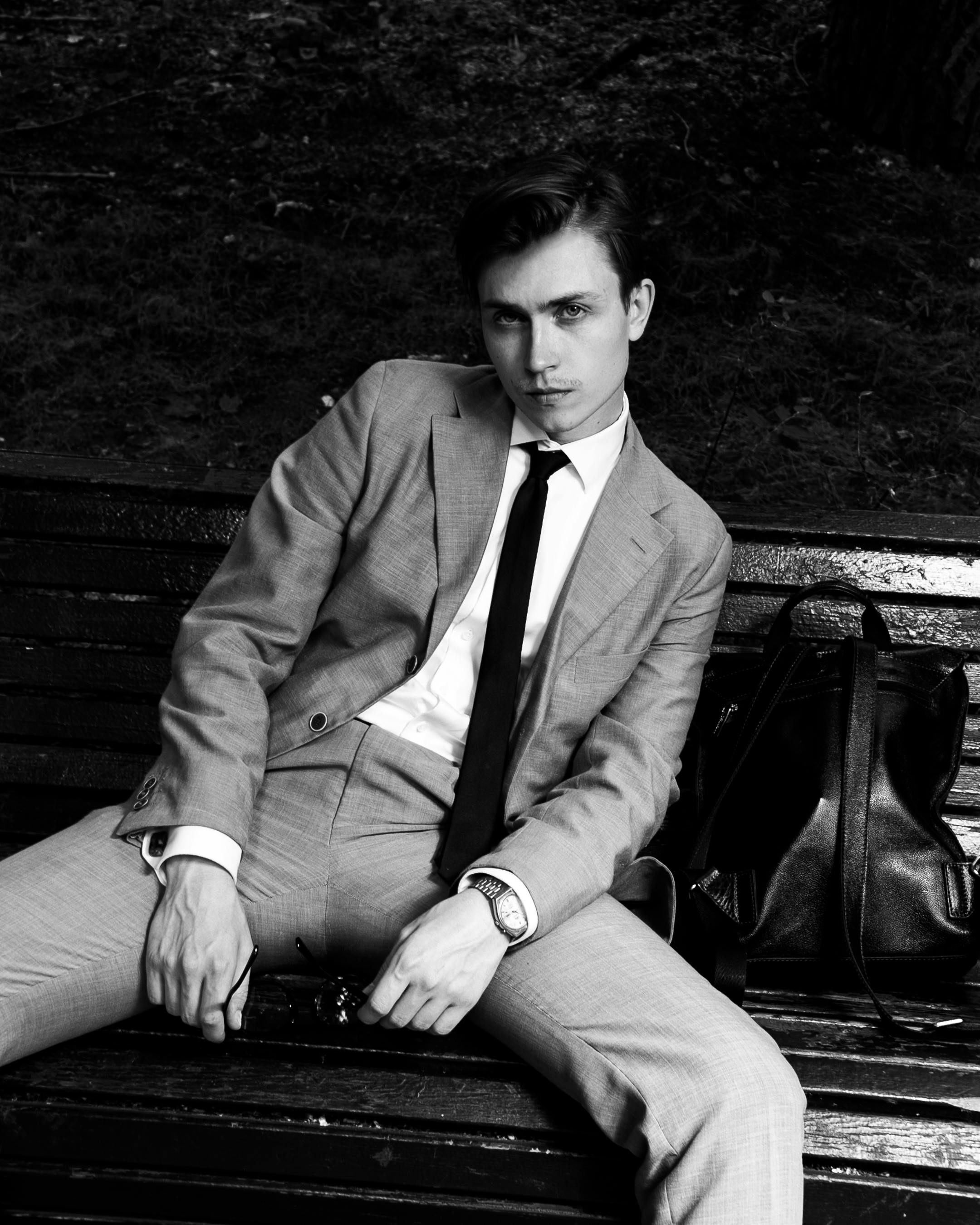 Man in Suit Sitting on Bench · Free Stock Photo