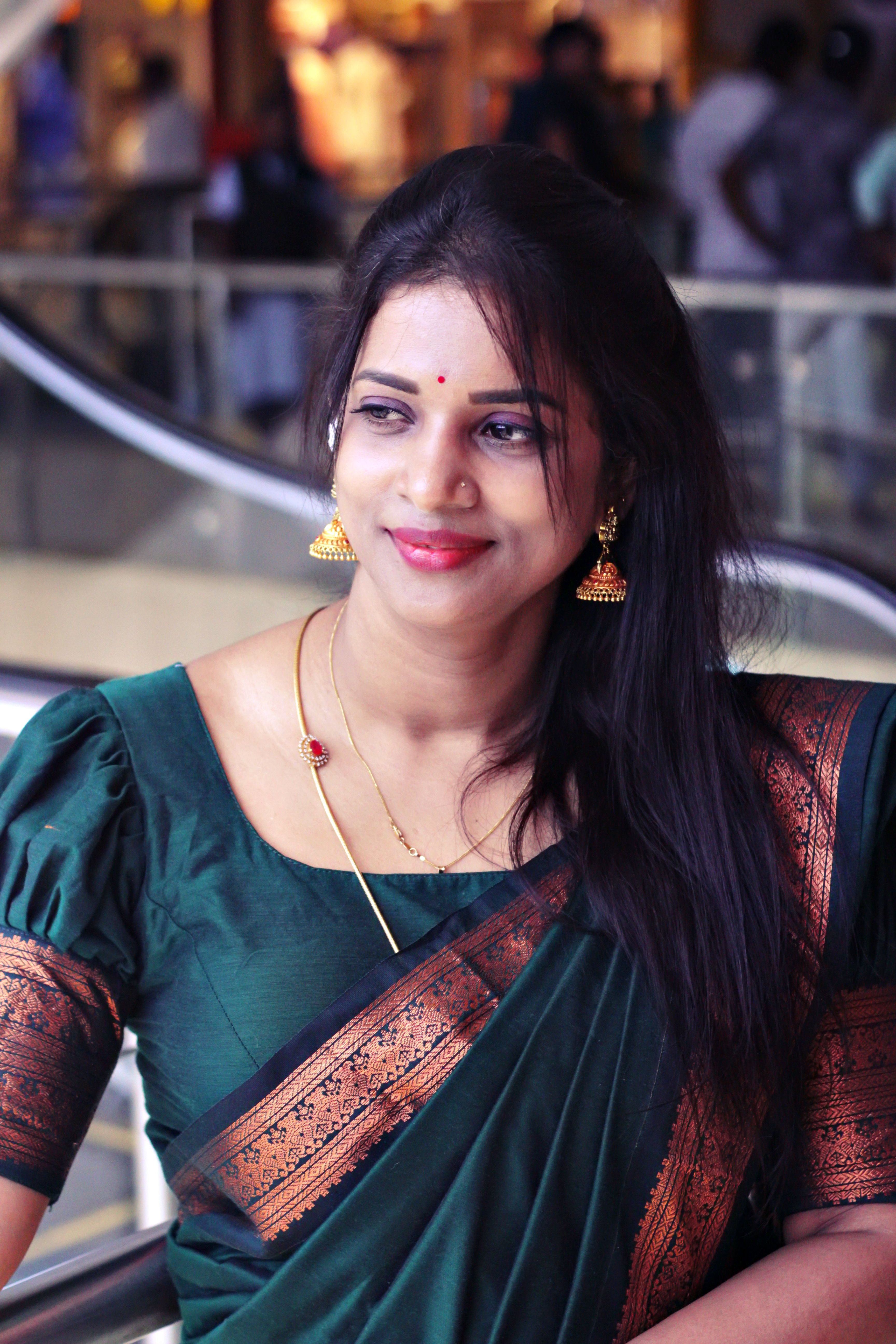 A Young Woman in Traditional Hindu Clothing · Free Stock Photo