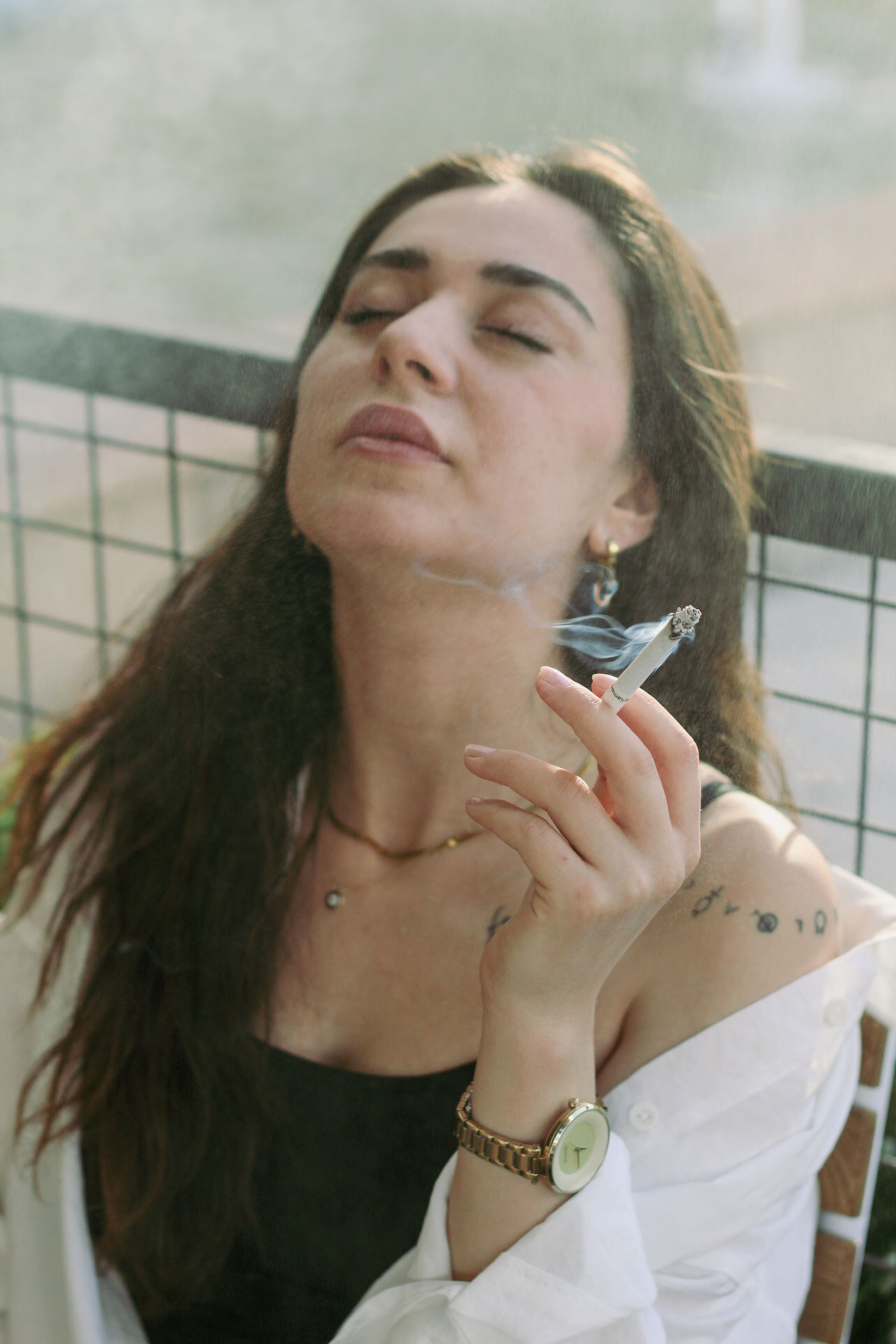 Close-up of Woman Smoking in Bathroom · Free Stock Photo