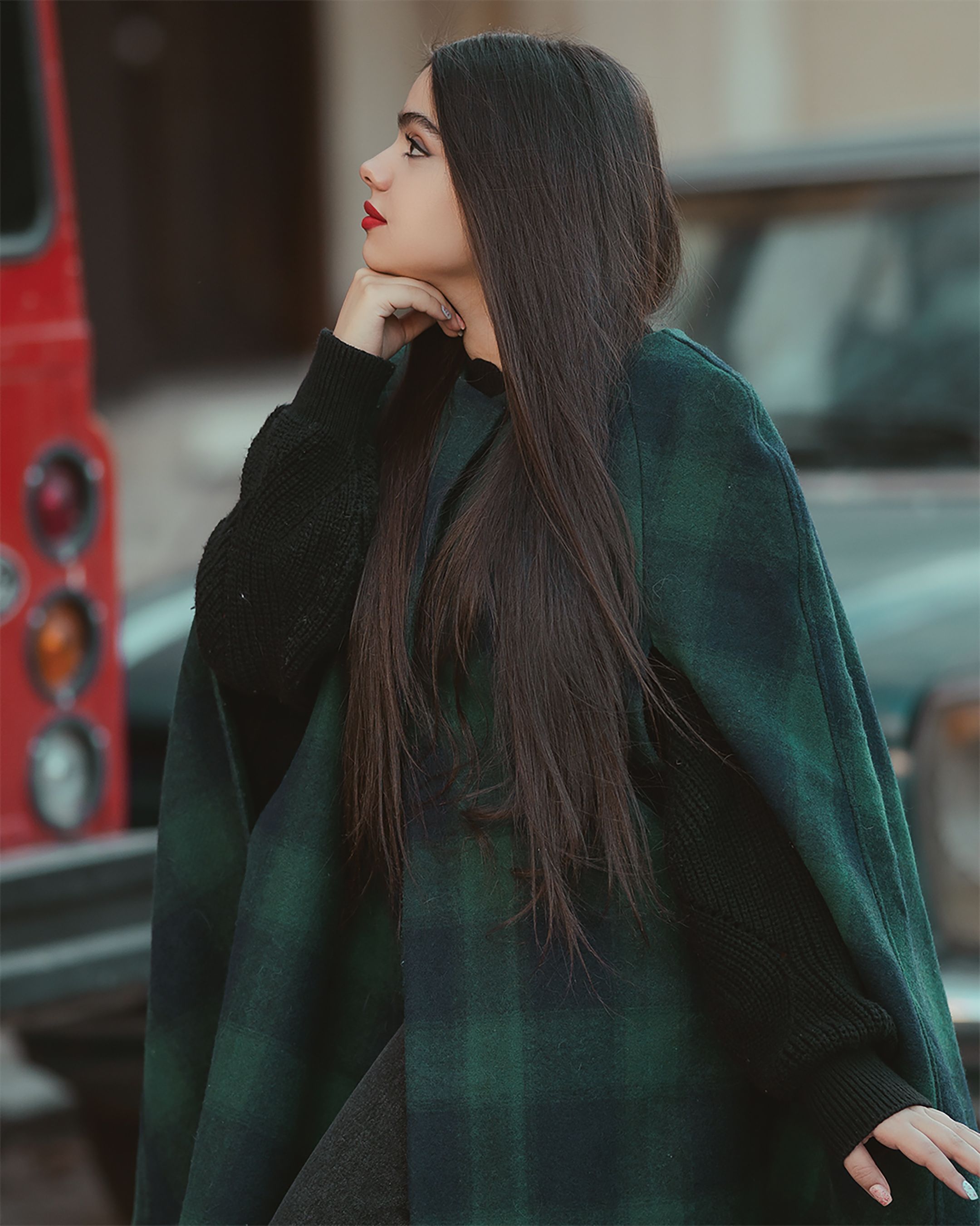 Brunette Woman Posing in Green Plaid Poncho · Free Stock Photo