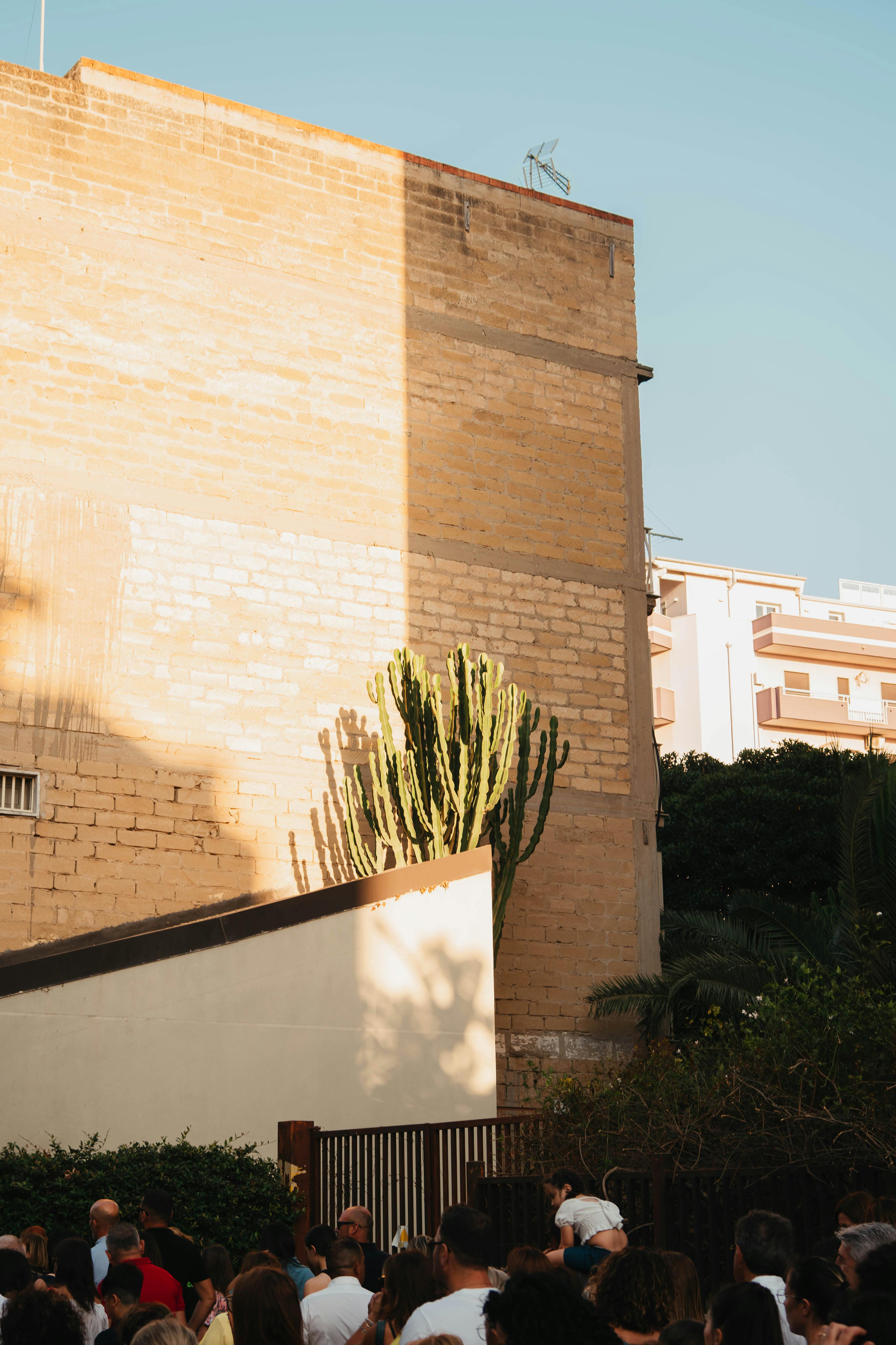 A crowd of people standing outside a building · Free Stock Photo