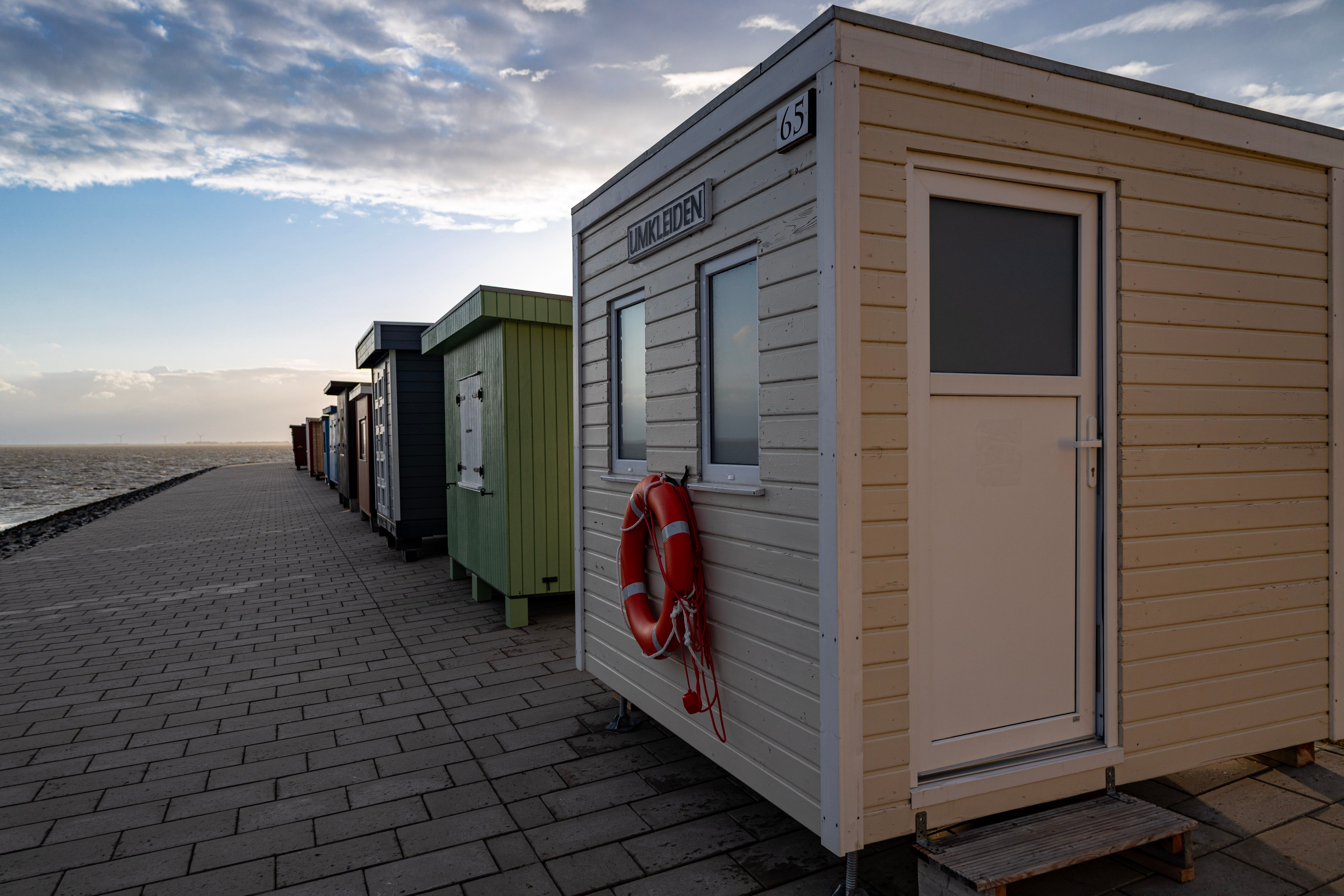 Sheds on Pavement on Sea Shore · Free Stock Photo