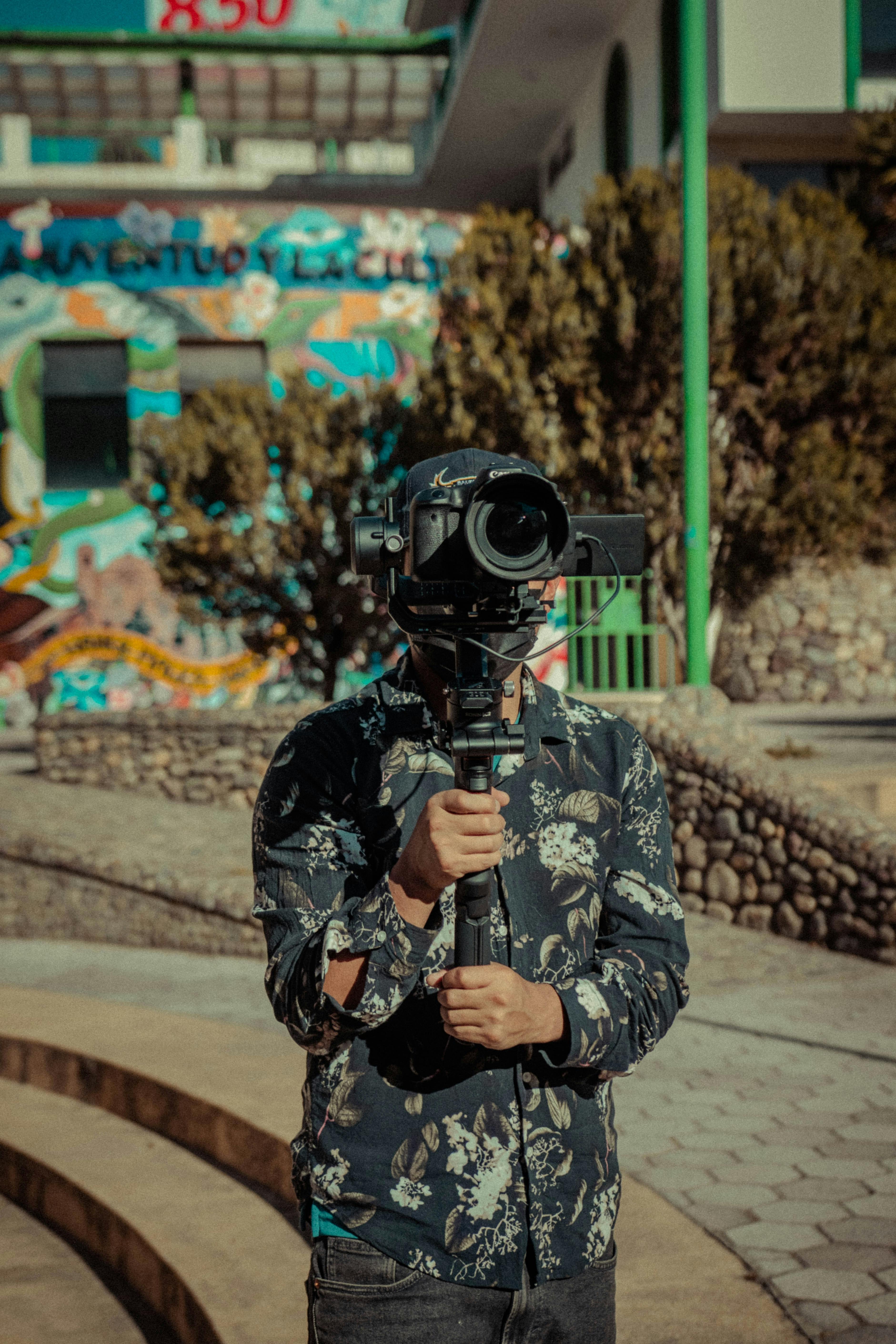 Man Standing with Camera · Free Stock Photo