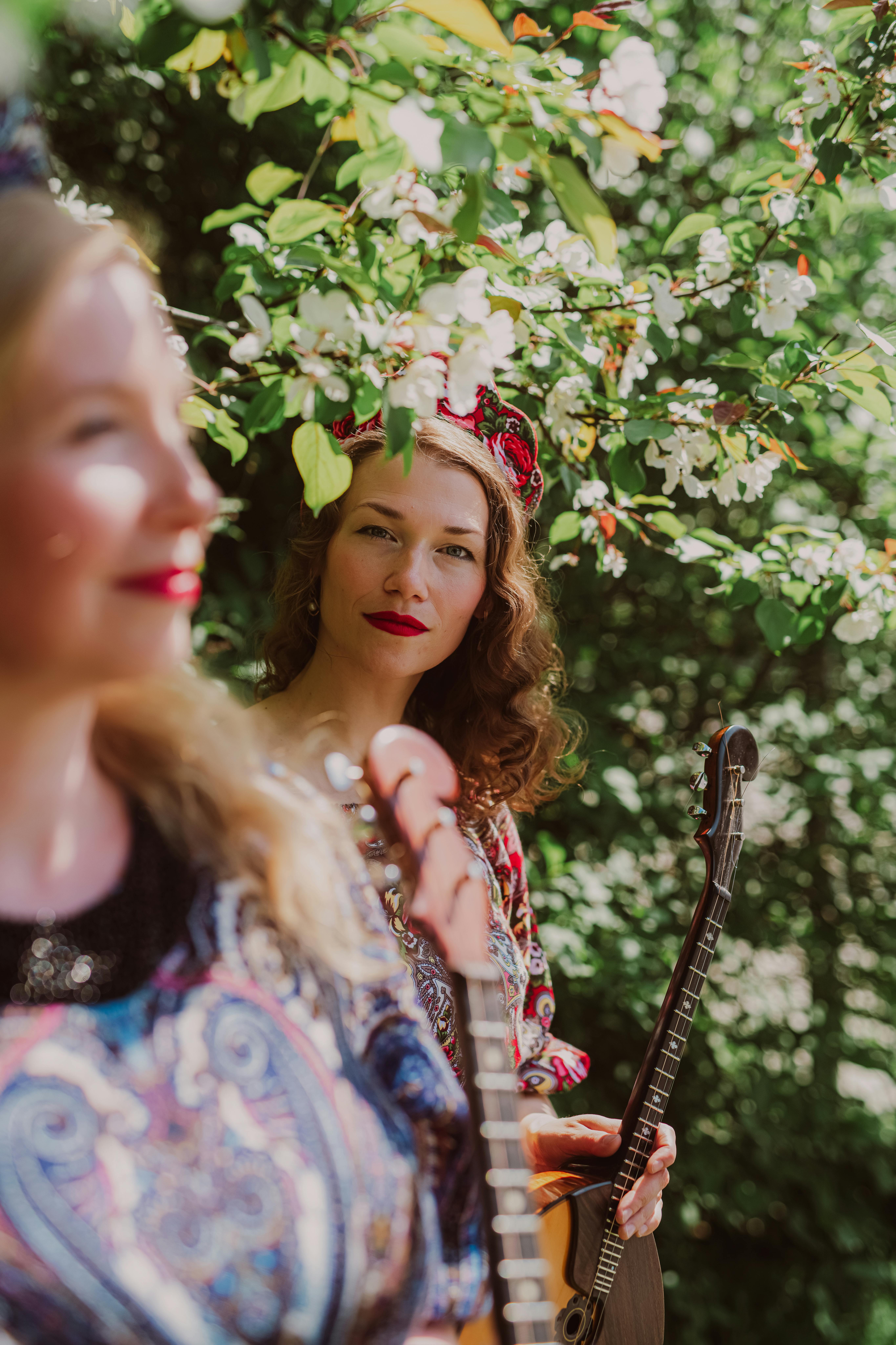 Women with Instrument under Leaves · Free Stock Photo