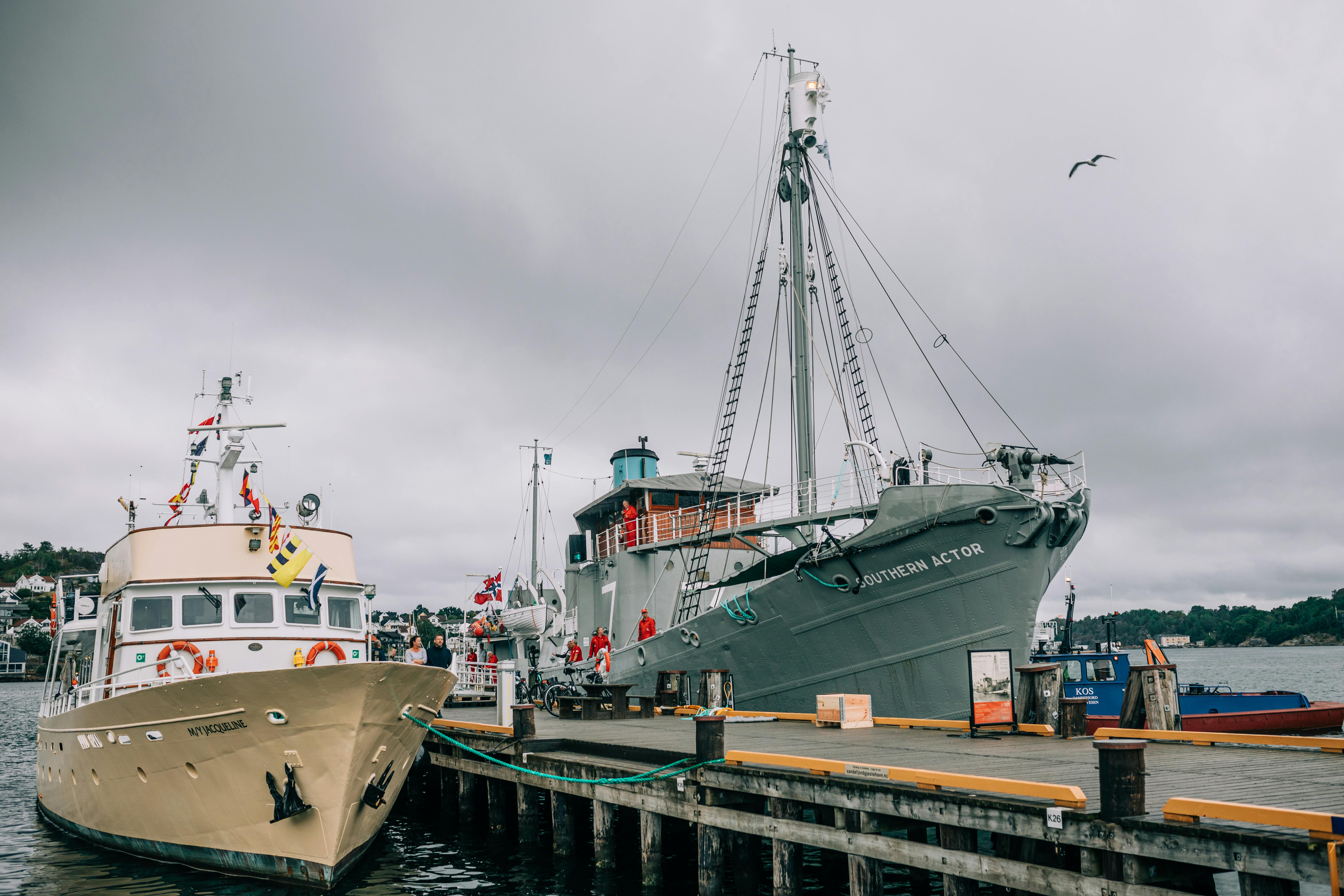 White Sailing Ship Docked at Pier · Free Stock Photo