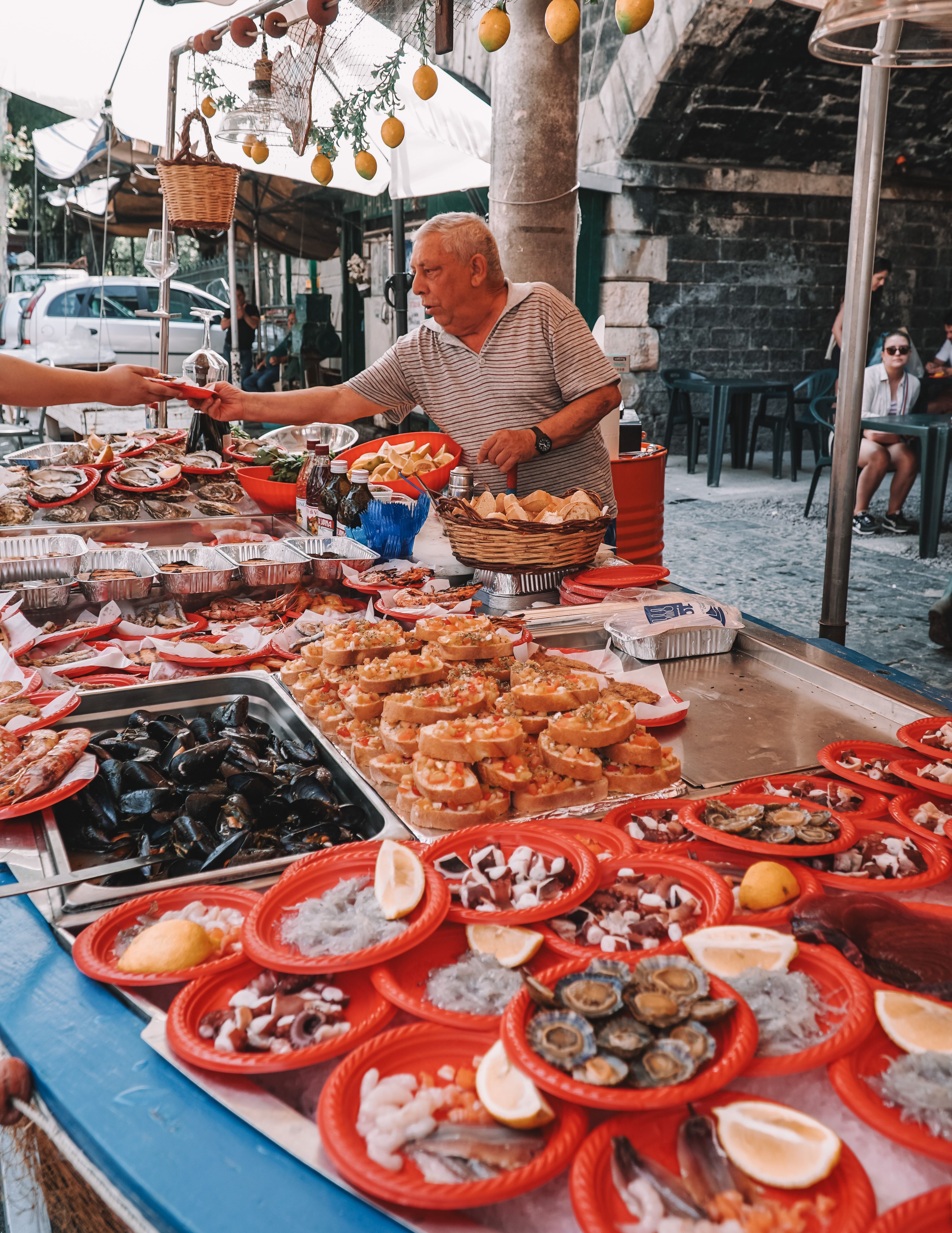 Man Selling Traditional Food at the Market · Free Stock Photo