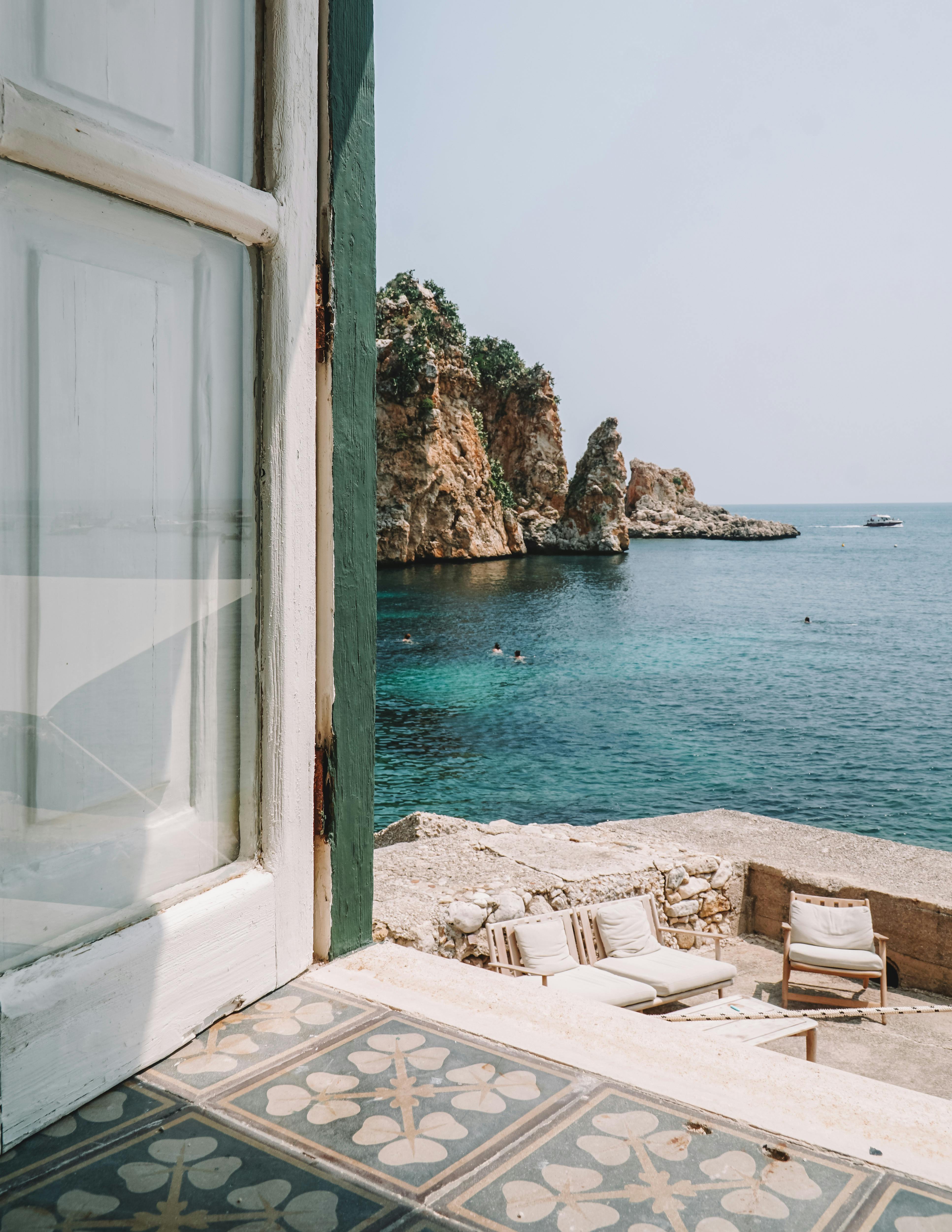 Terrace behind Window Opening on Sea Shore · Free Stock Photo