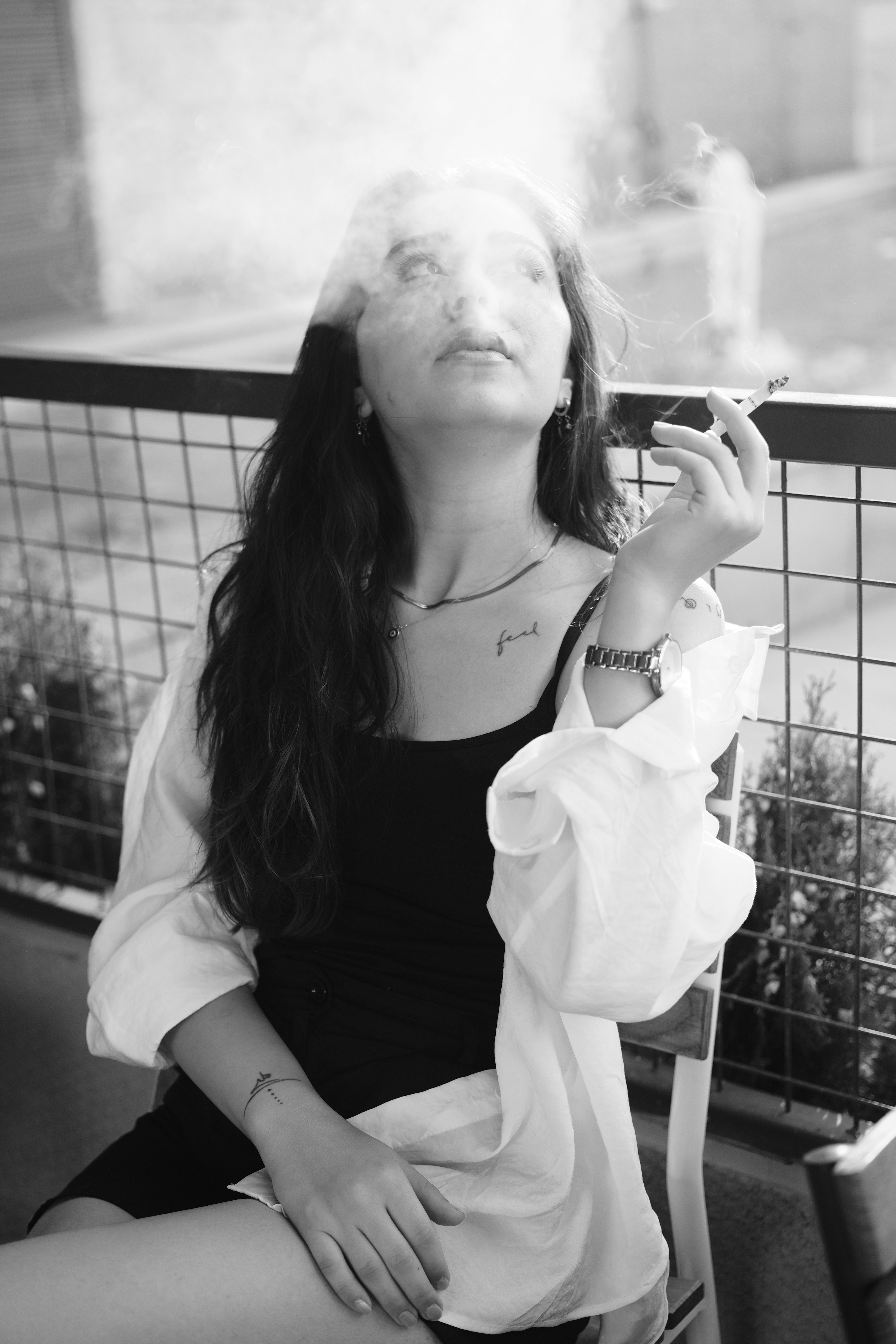 Woman Smoking Cigarette in Black and White · Free Stock Photo