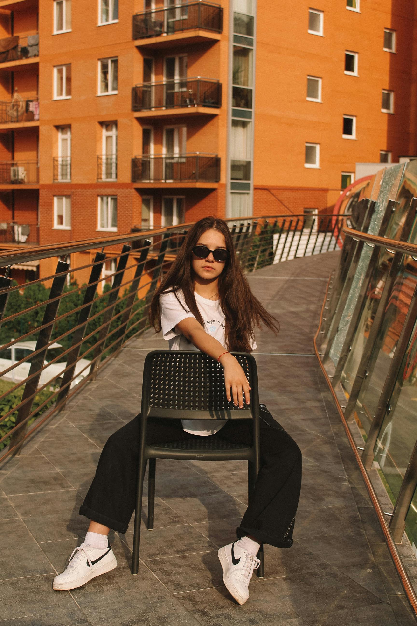 Woman Sitting Backwards on Chair · Free Stock Photo