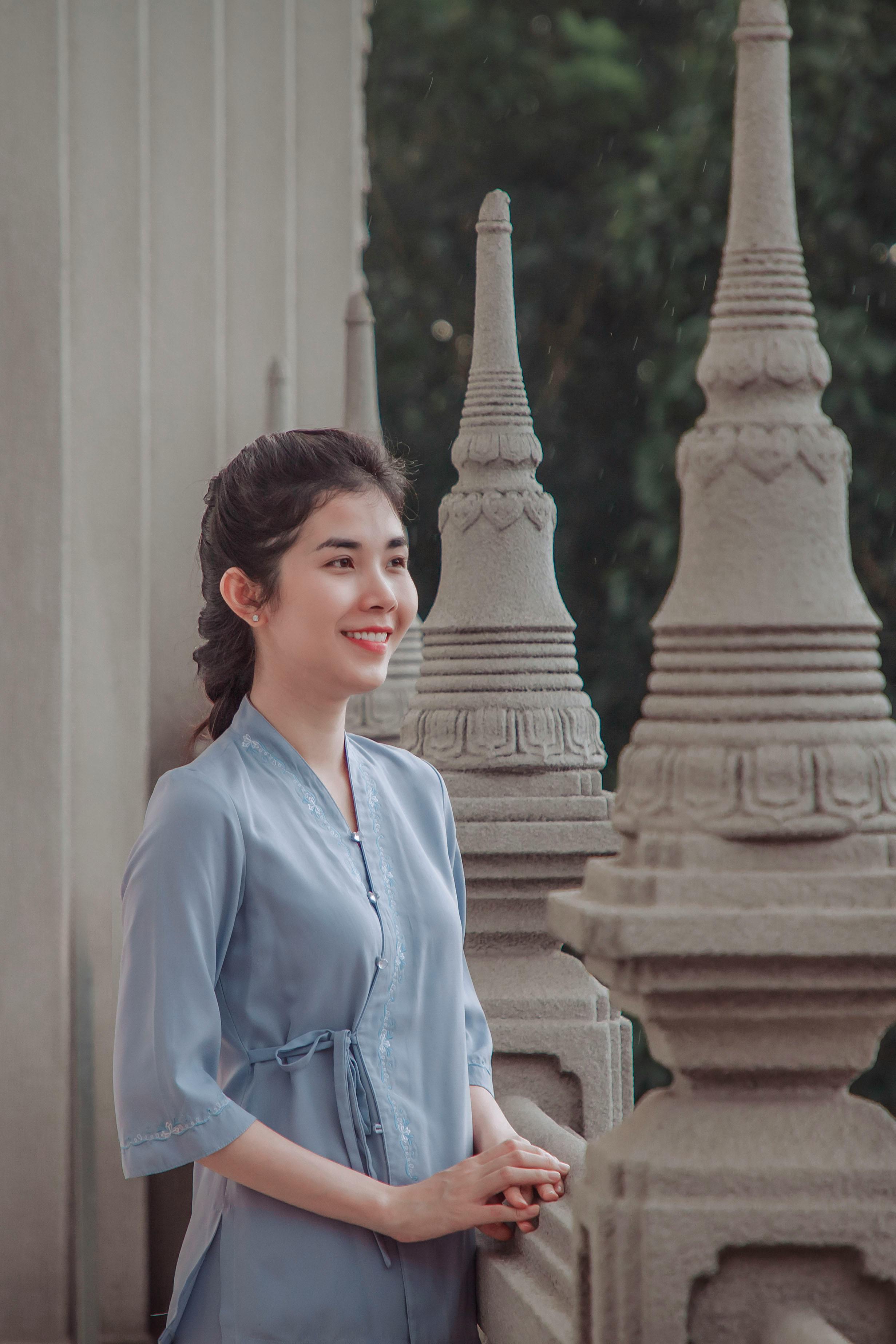 Woman in Blue Clothes and Hat on Sea Shore · Free Stock Photo