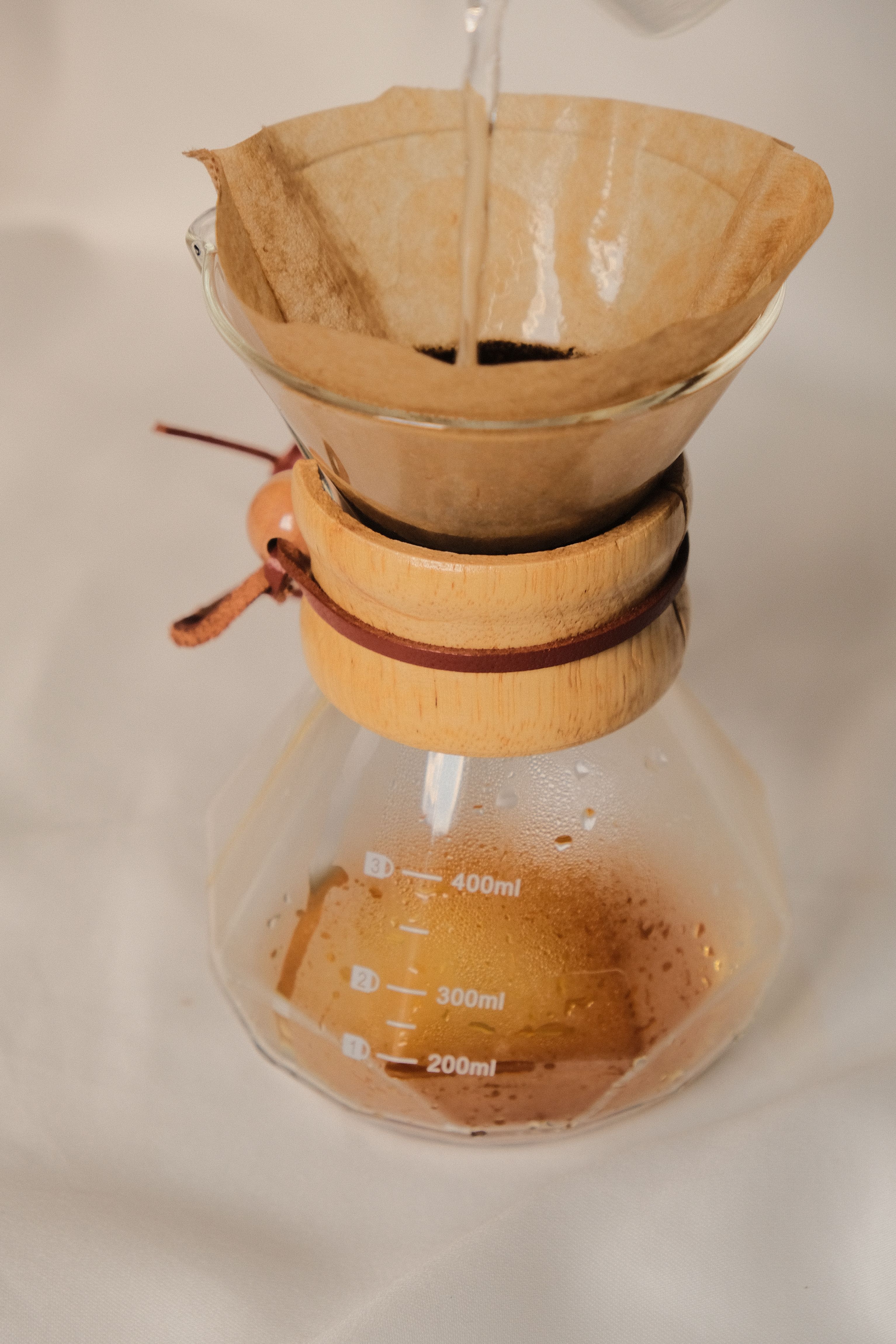 Pouring Water through Sieve to Pitcher · Free Stock Photo