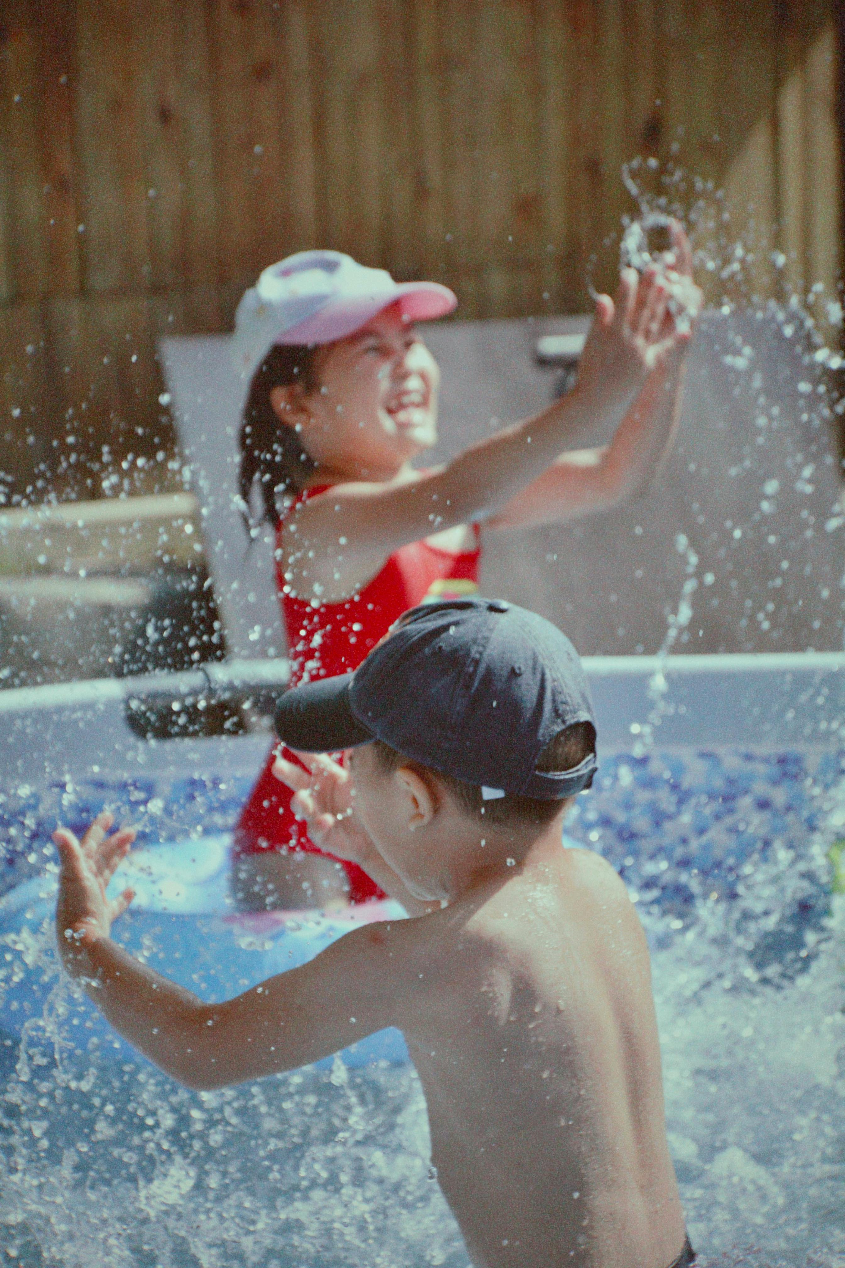 Two Children Playing in a Swimming Pool · Free Stock Photo