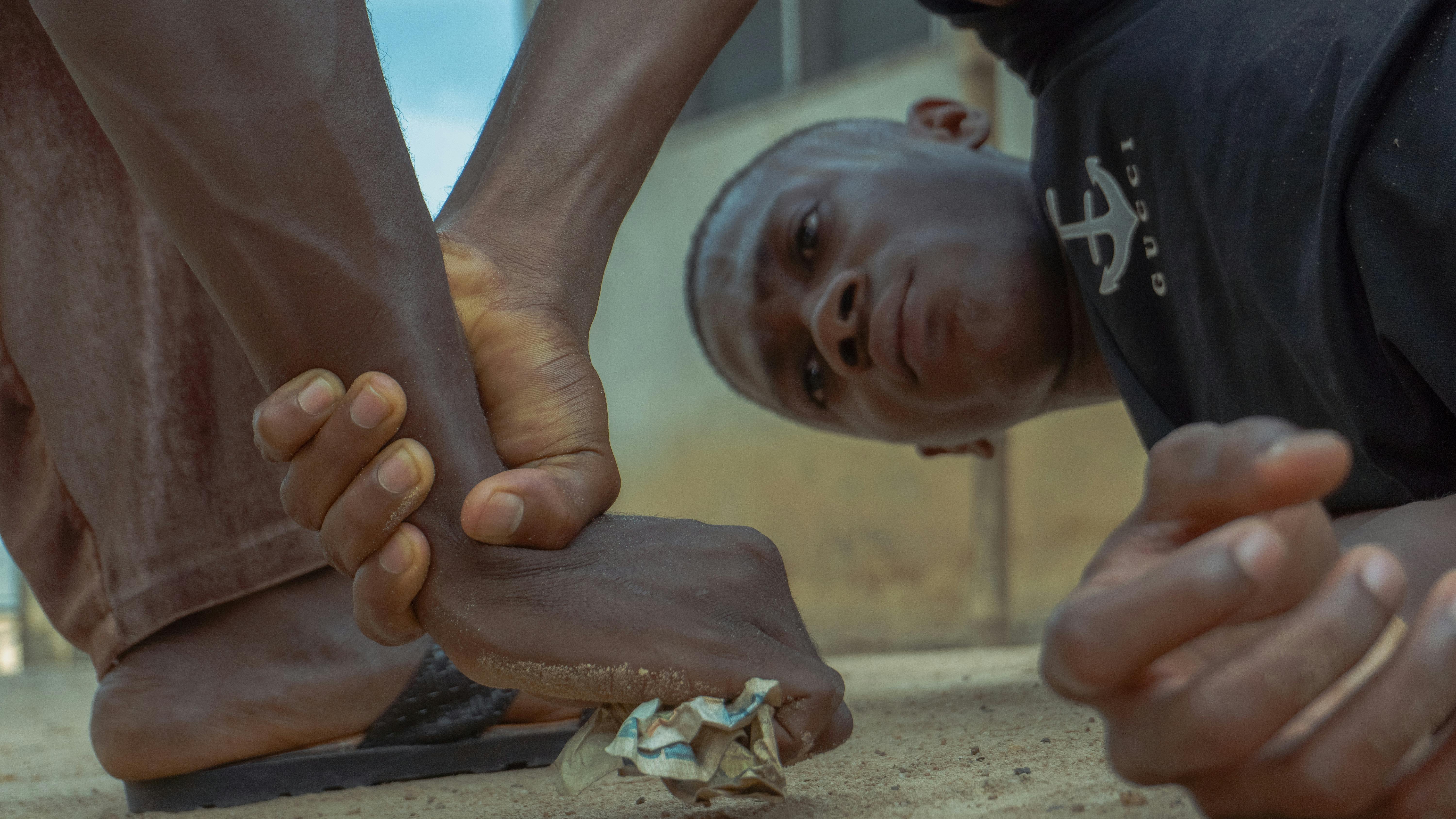 Men Lying Down and Holding Hand · Free Stock Photo