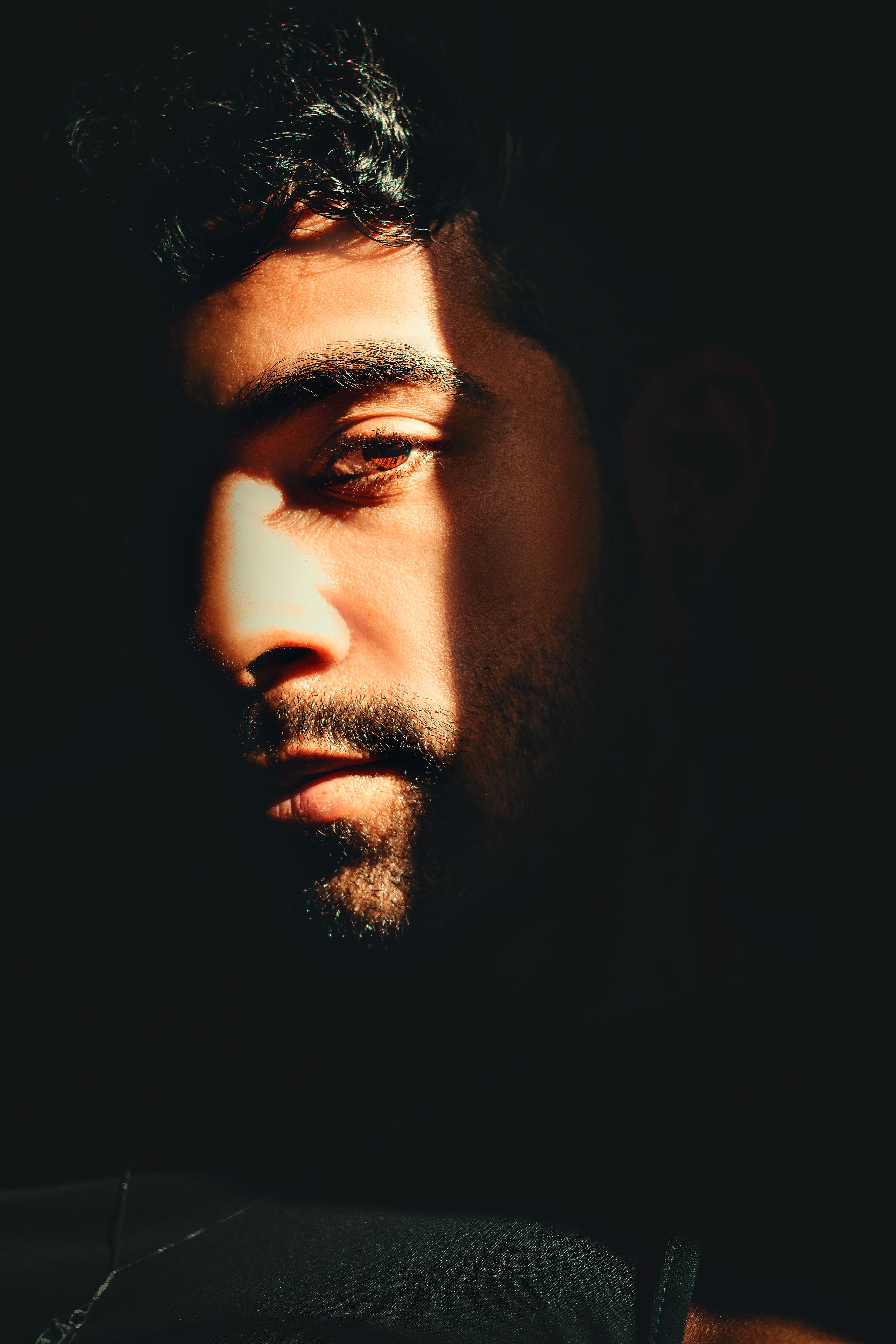 Picture of a Young Man with the Sun Shining on a Part of His Face ...