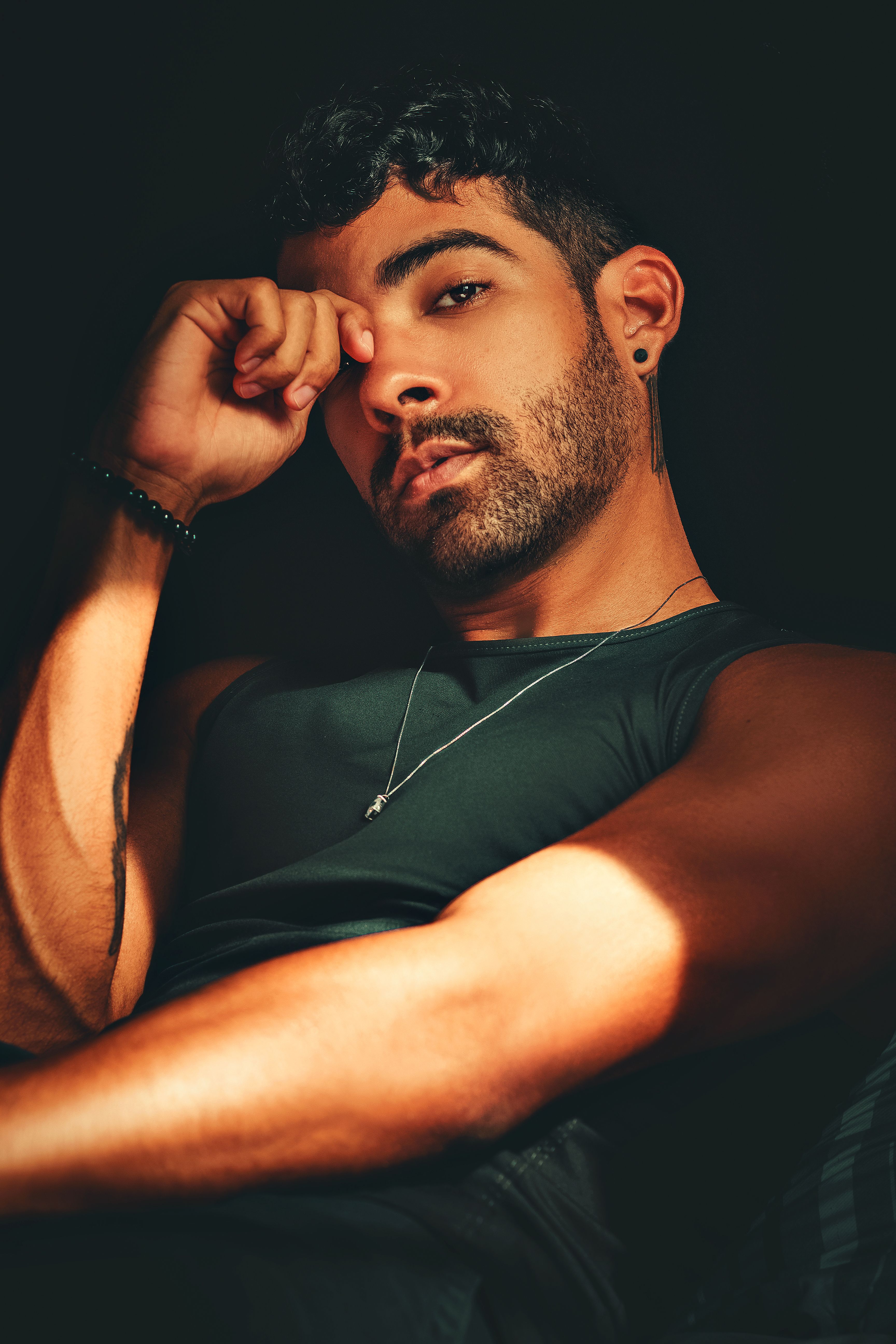 Young Man with a Stubble Posing in Casual Clothing · Free Stock Photo