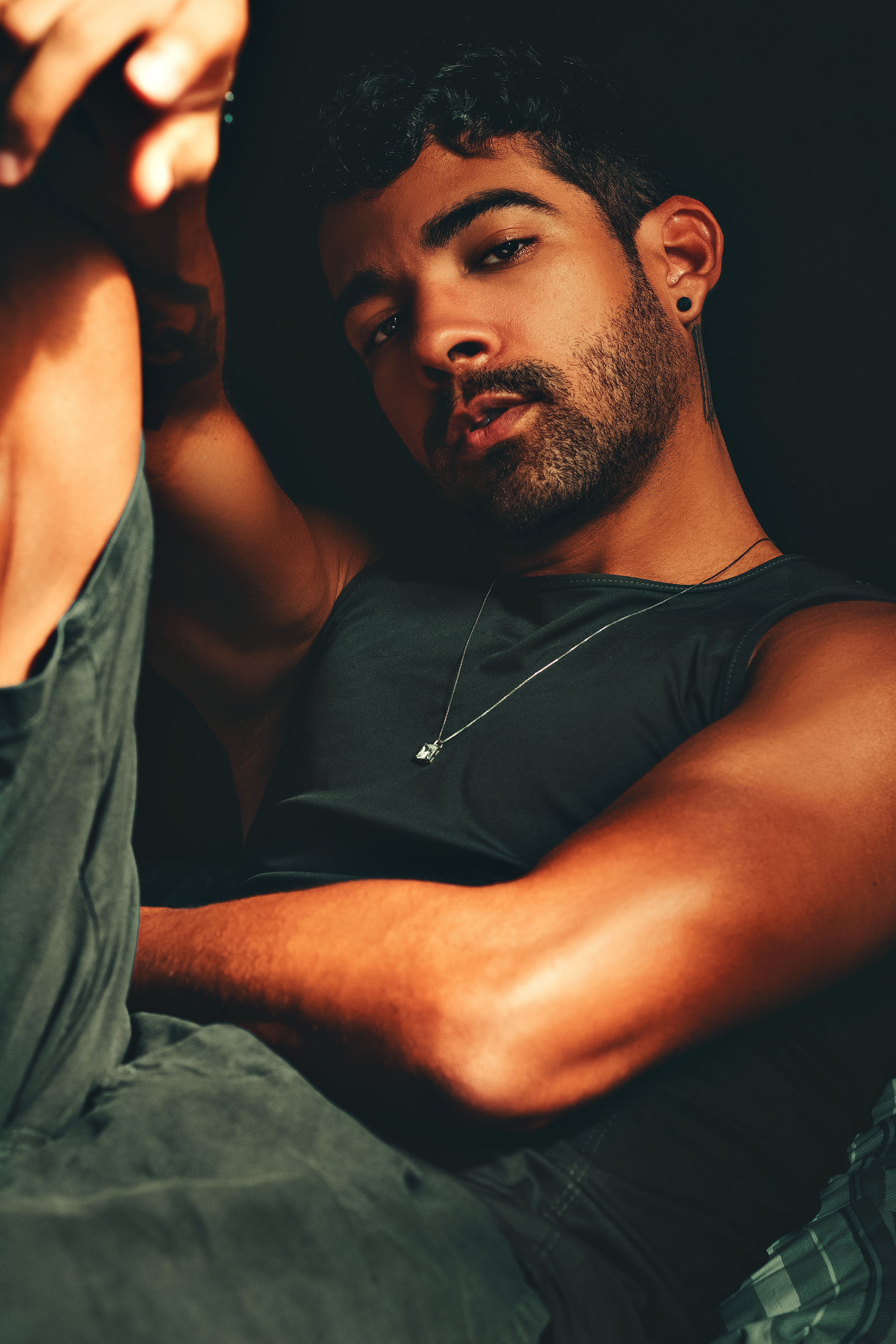 Young Man with a Stubble Posing in Casual Clothing · Free Stock Photo