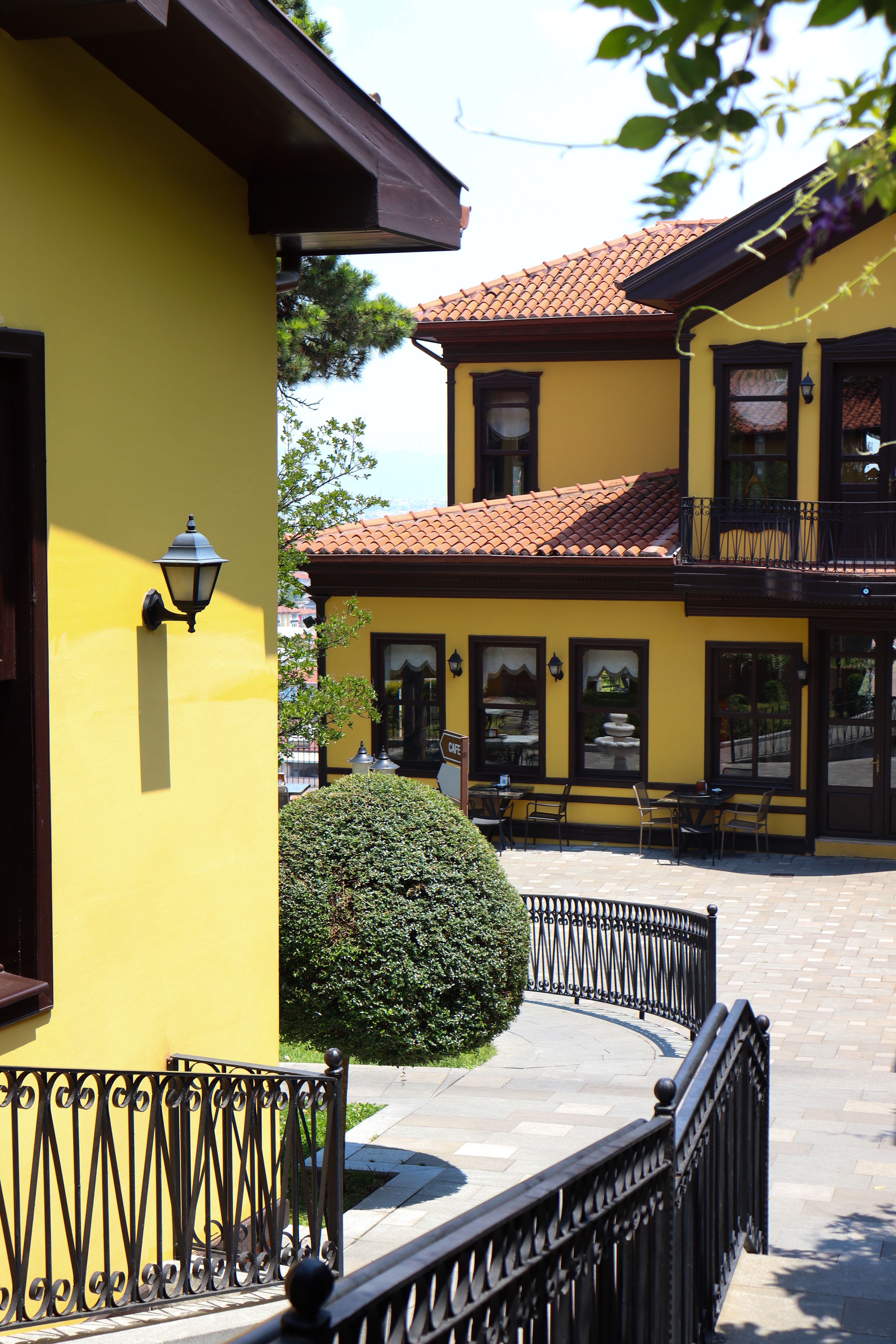 View of Yellow Buildings and a Pavement in a Town · Free Stock Photo