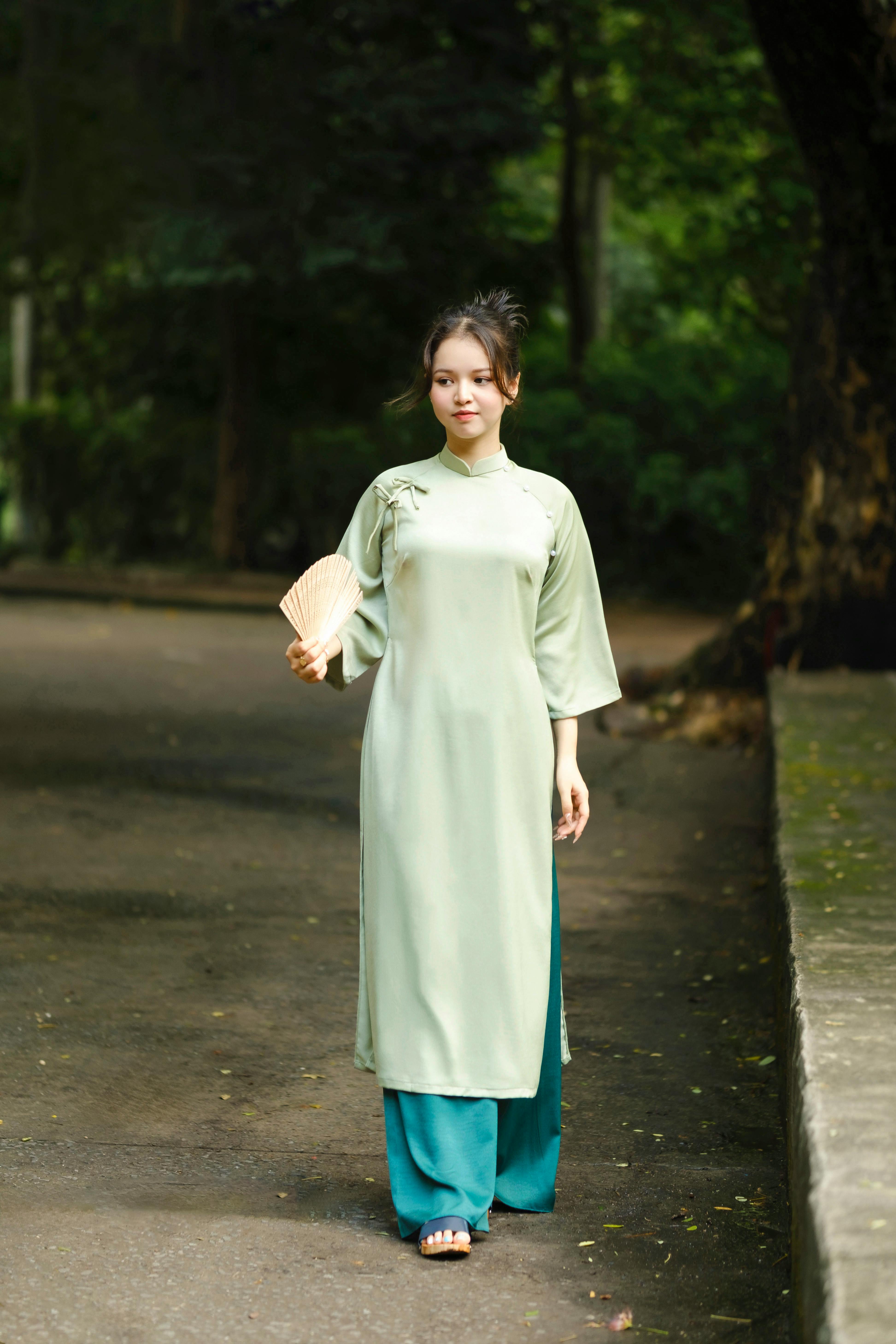 Young Woman in Traditional Dress Walking in Summer Park · Free Stock Photo
