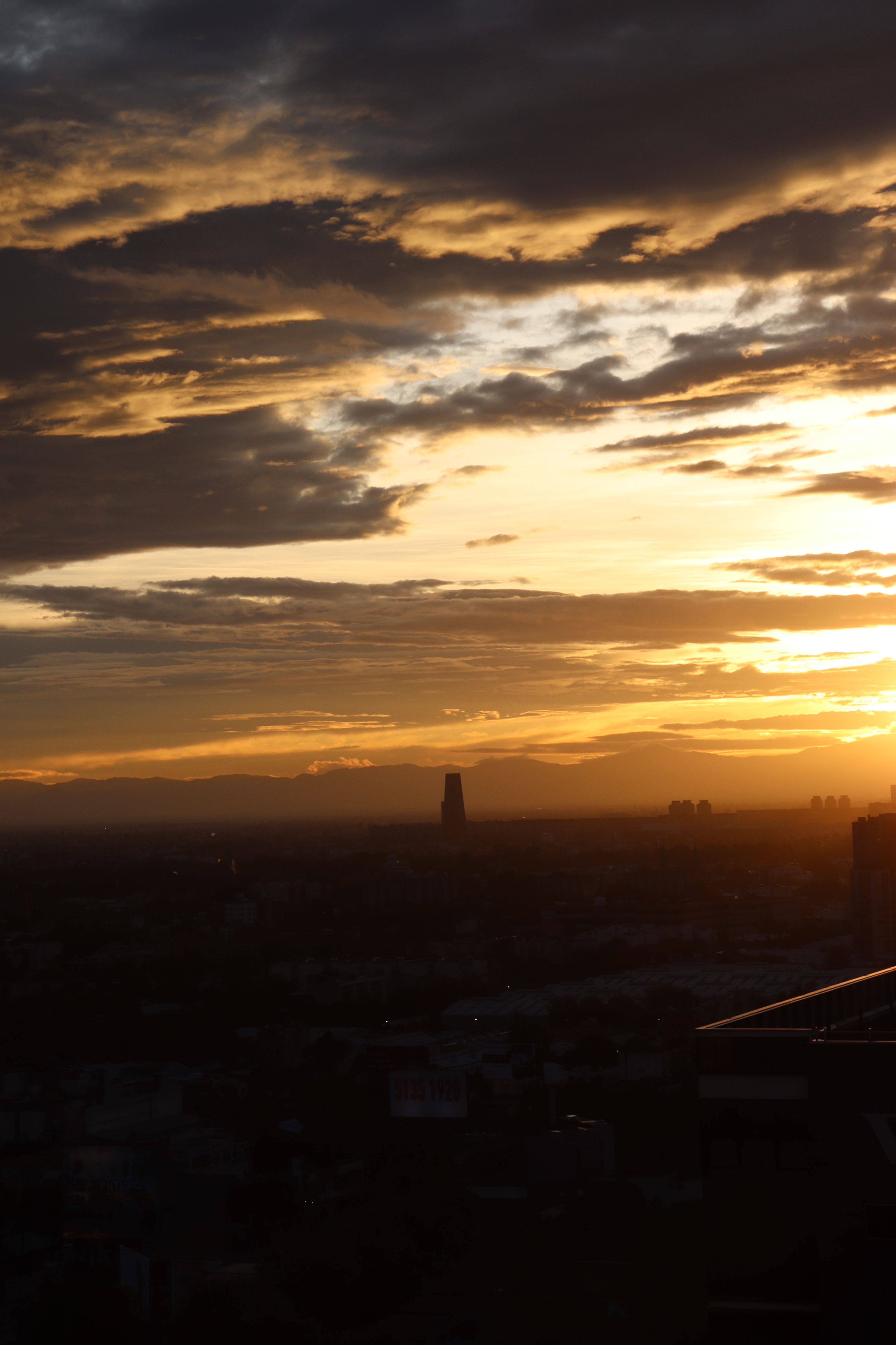 Silhouetted Cityscape at Sunset · Free Stock Photo