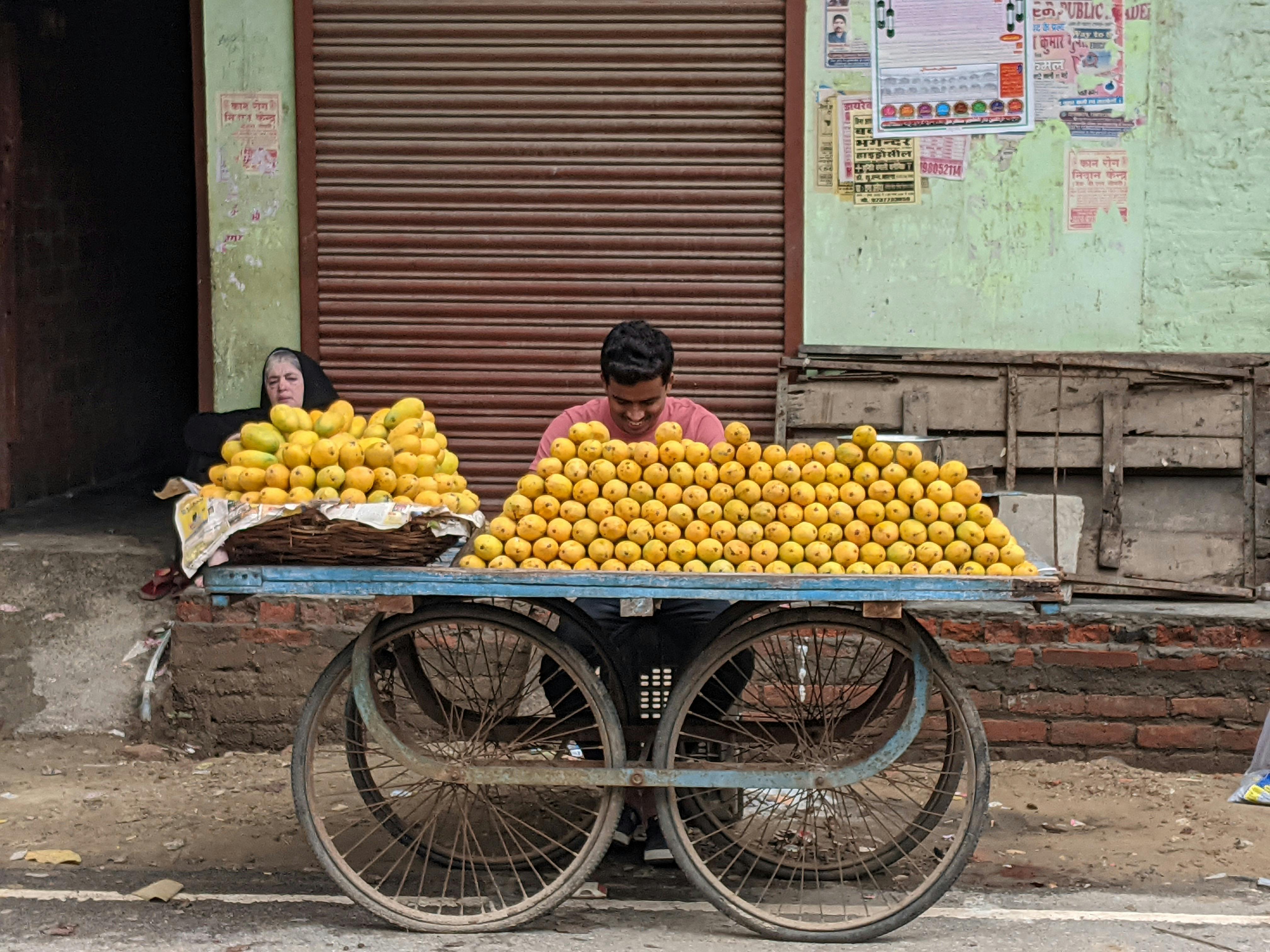 Street Vendors Selling Mango Fruits from their Cart · Free Stock Photo