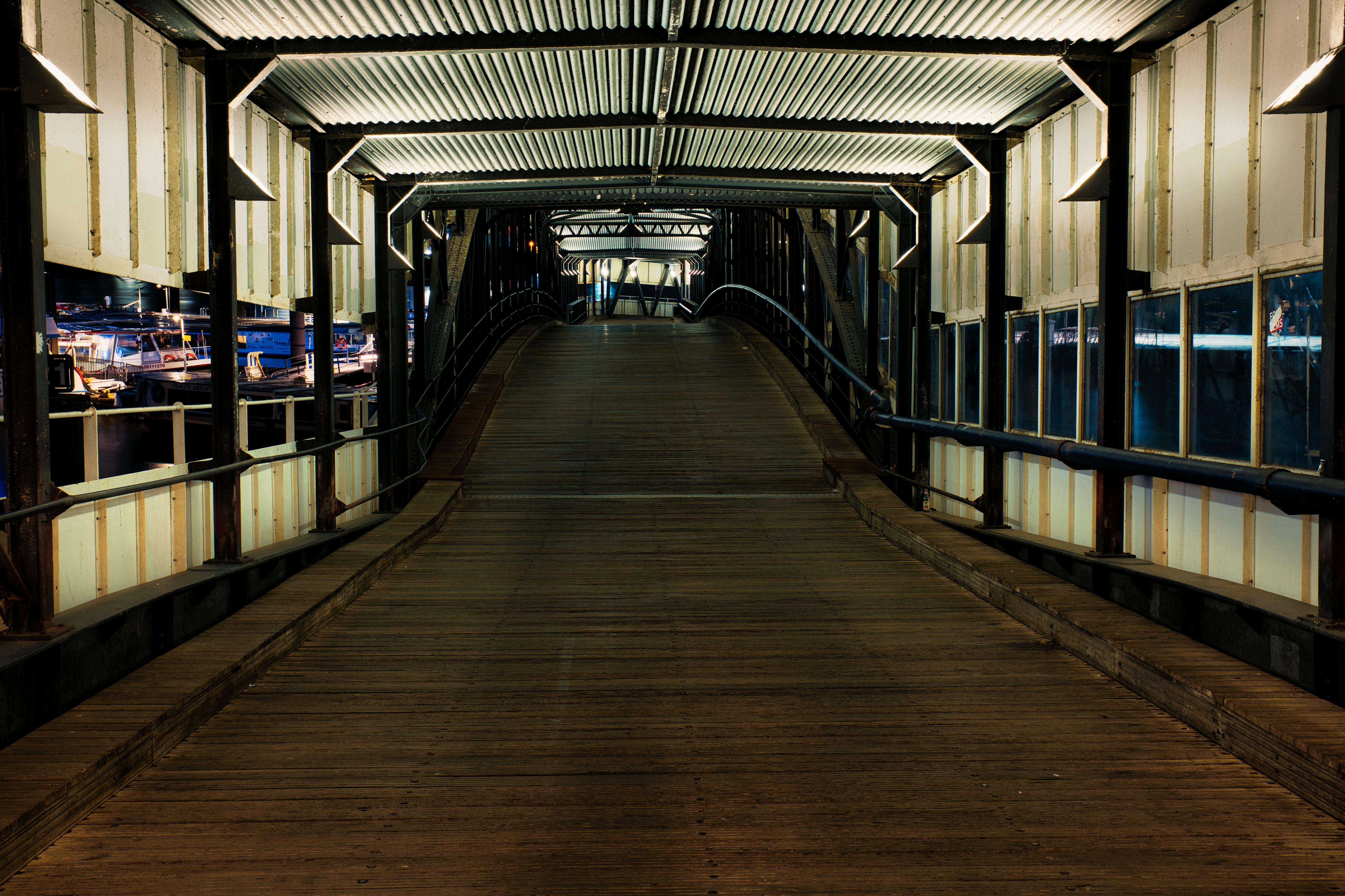 Roofed Jetty Bridge in a Port at Night · Free Stock Photo