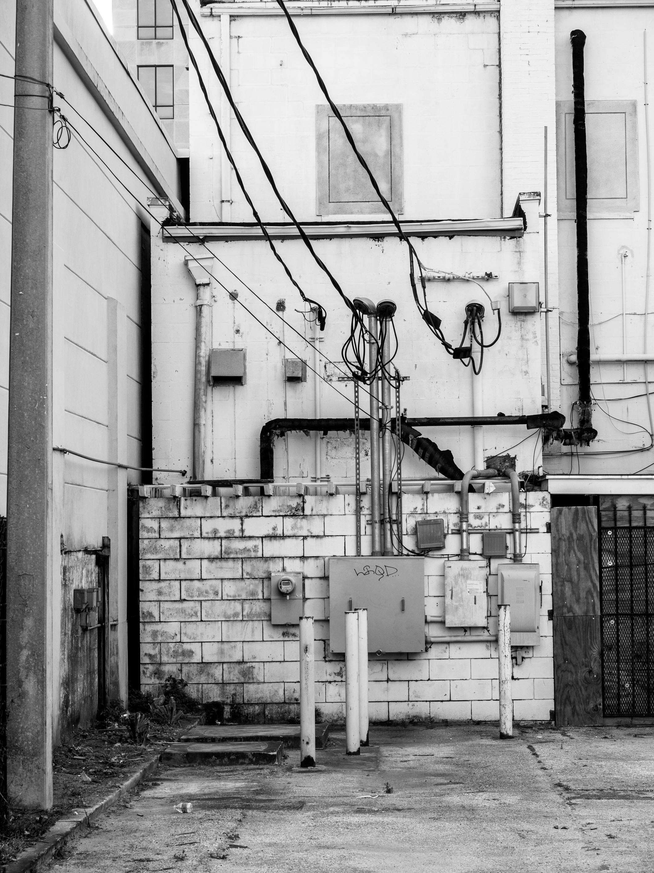 Power Lines and Electricity Boxes on Building Wall · Free Stock Photo