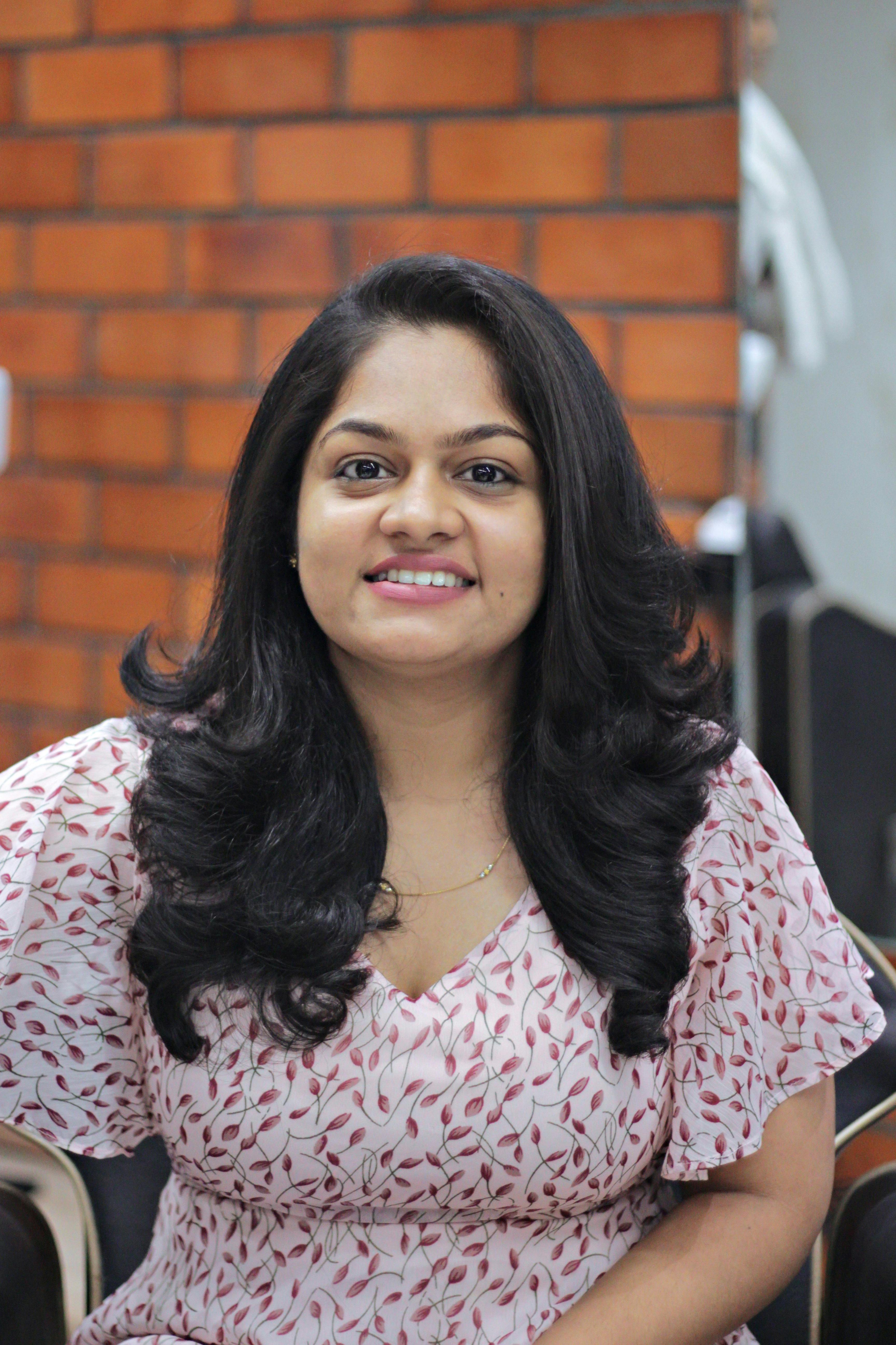 A Smiling Woman Serving a Customer · Free Stock Photo