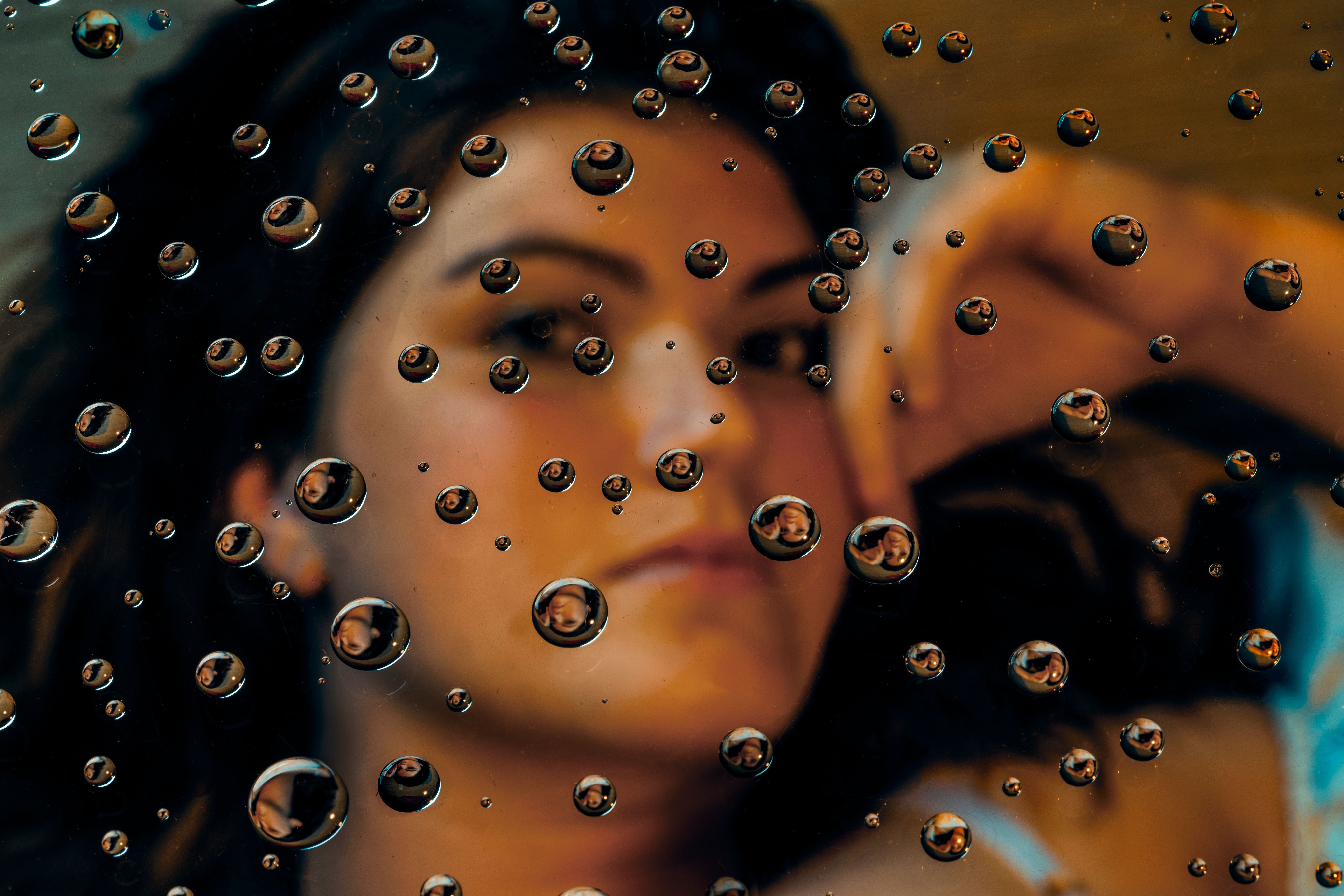 Woman Face behind and in Water Drops · Free Stock Photo