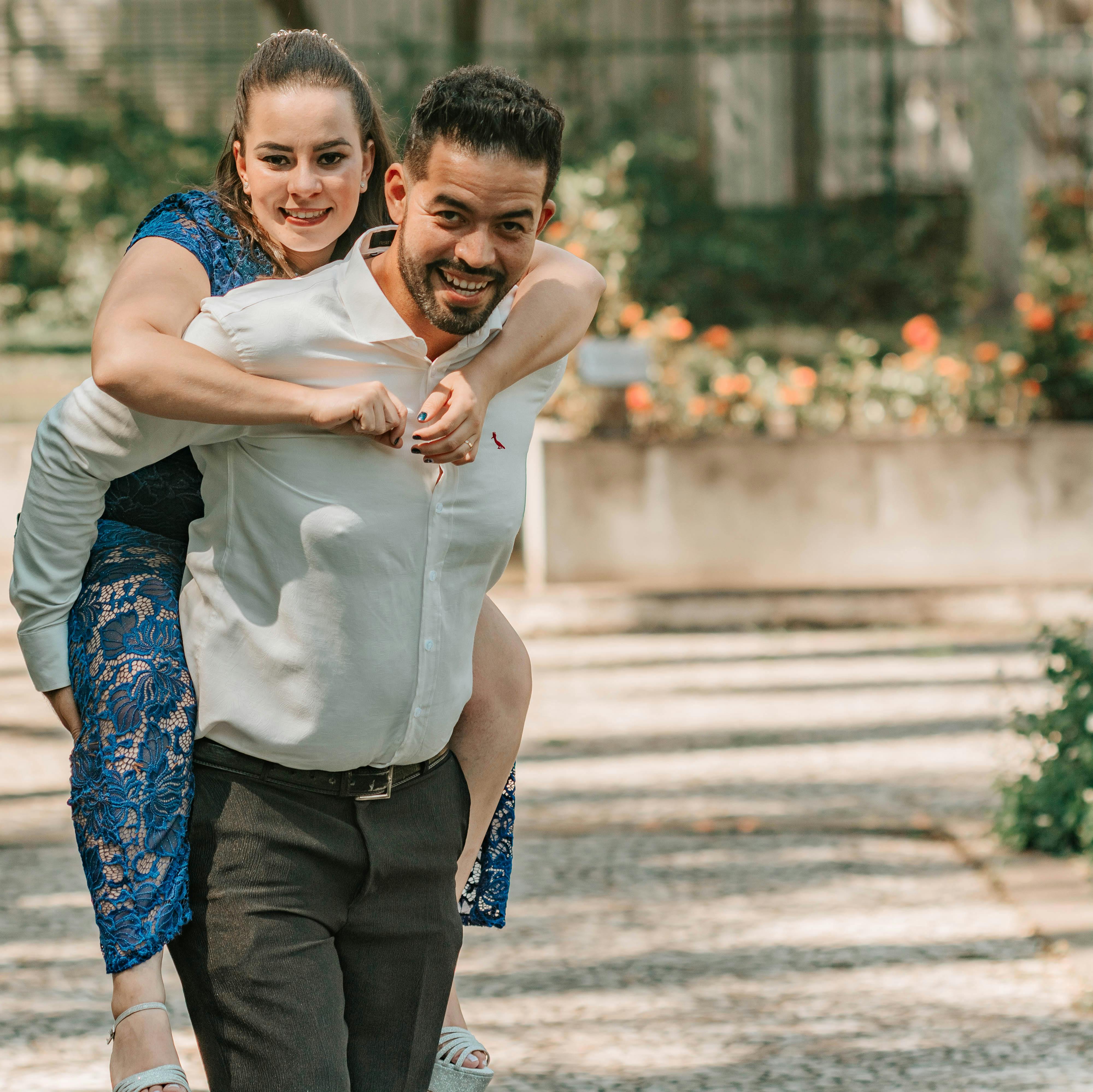 Man and Woman Leaning on Each Others Back · Free Stock Photo