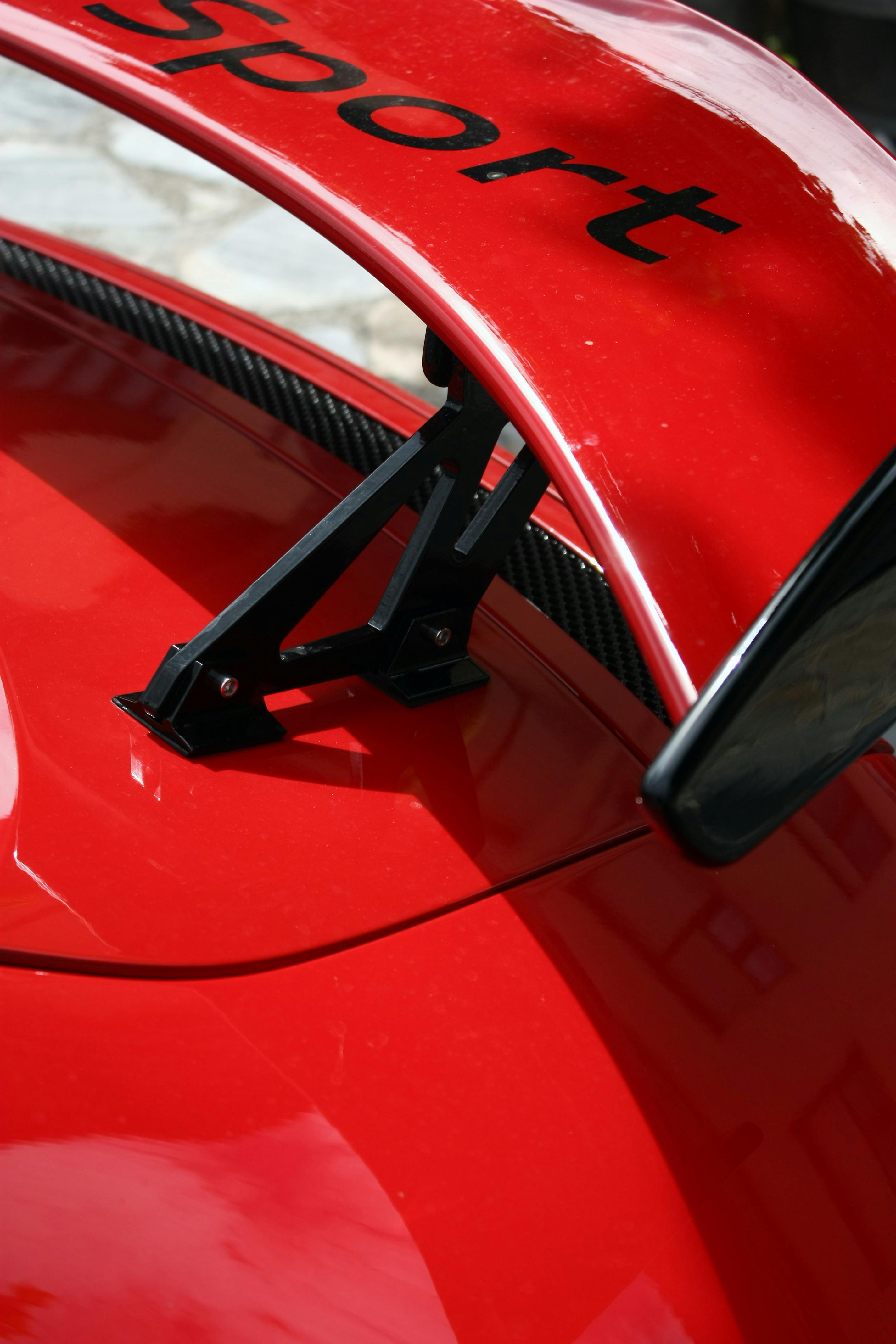 Close-up the Back of a Sports Car with a Spoiler · Free Stock Photo