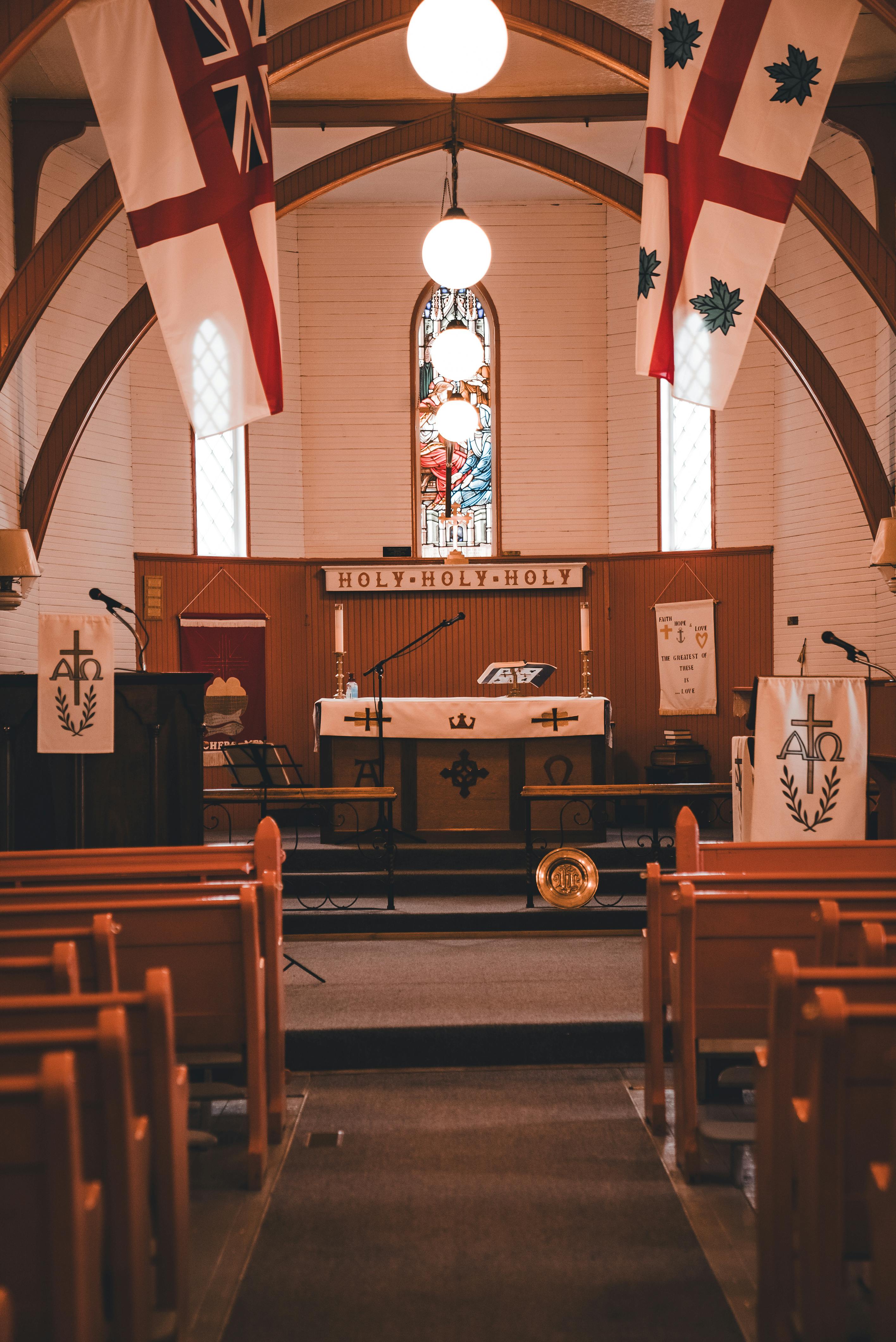 Illuminated Interior of an Empty Church · Free Stock Photo