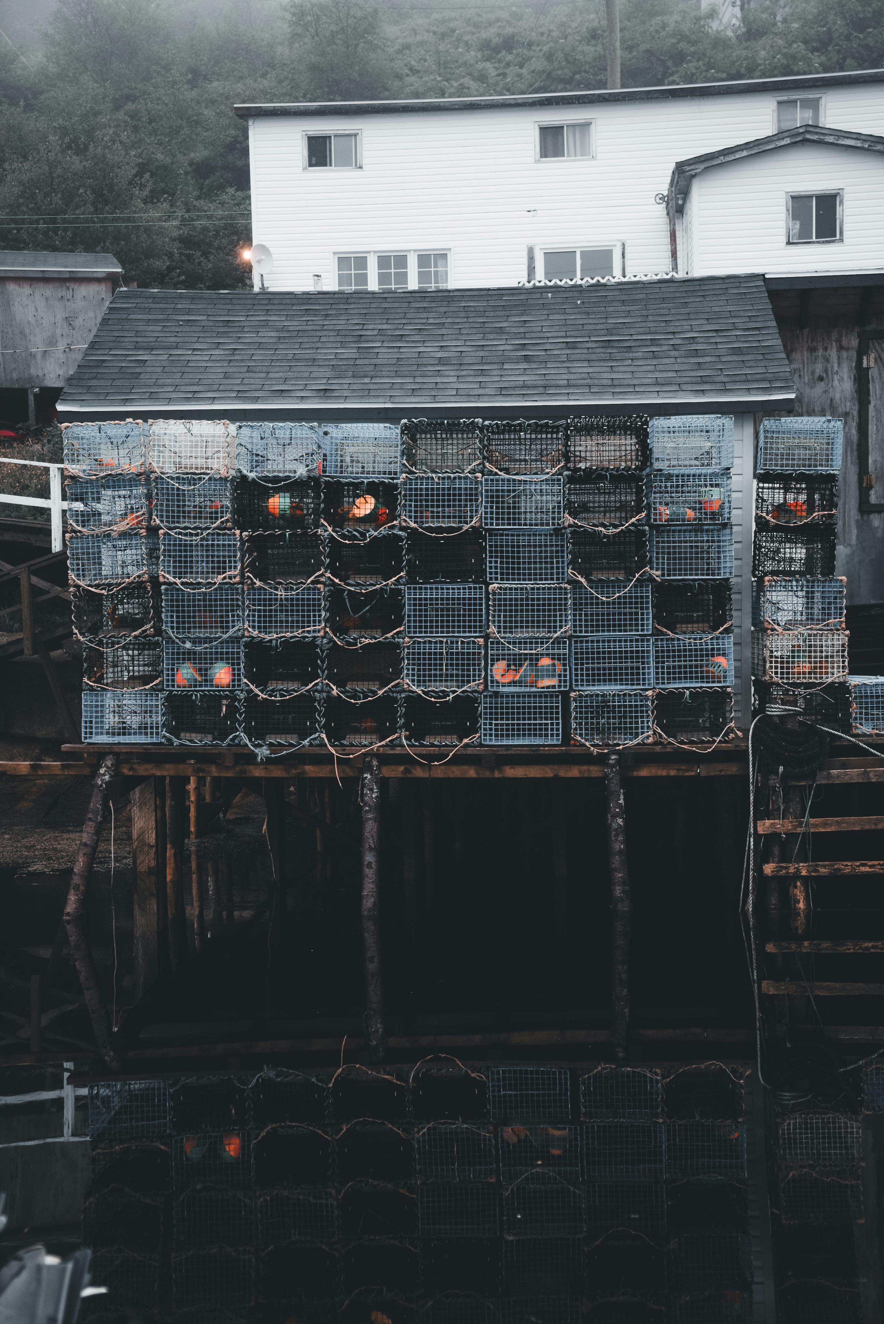 A Stack of Fishing Pots on a Waterfront · Free Stock Photo