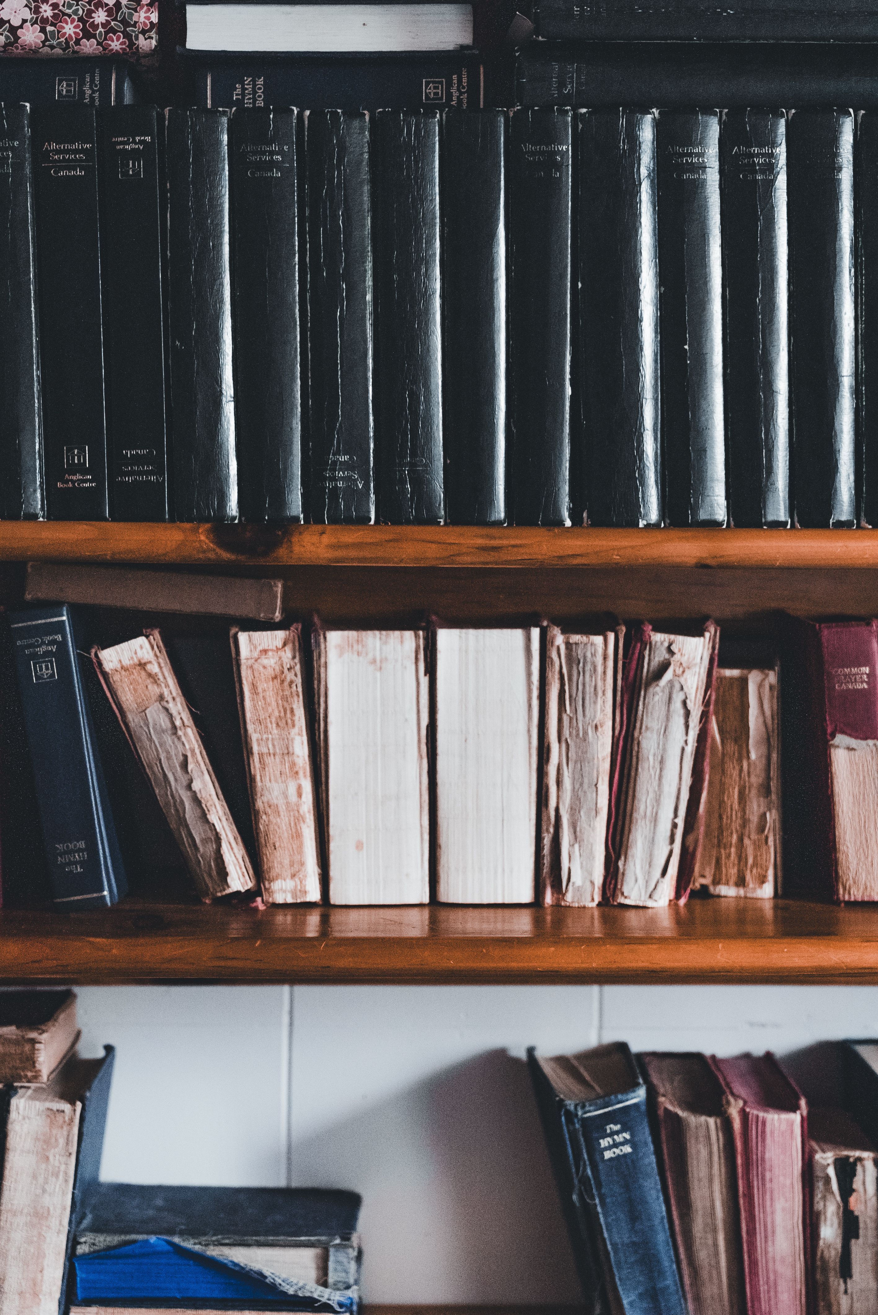 Stack of books on shelves at home · Free Stock Photo