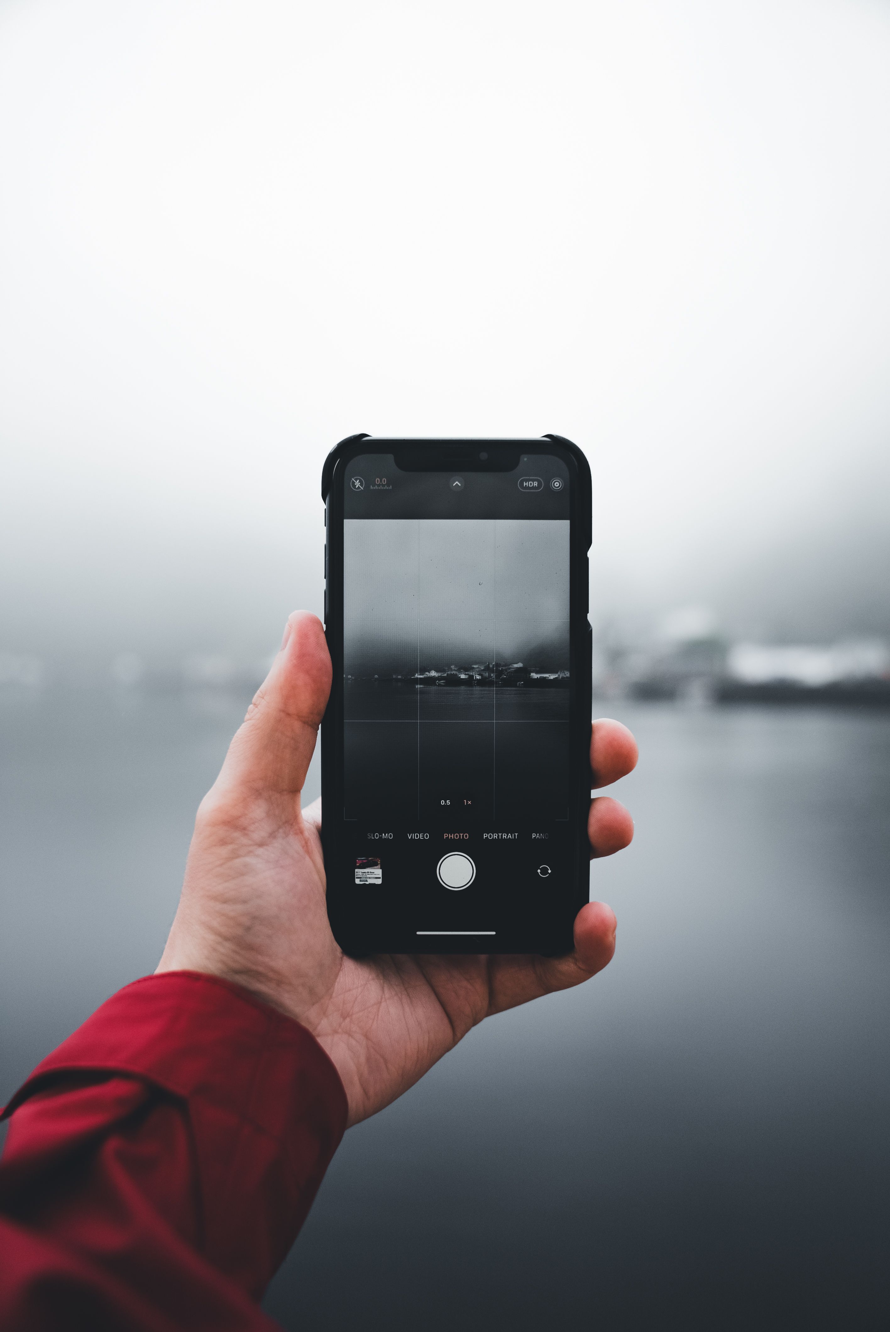 Man holding a Smart Phone and Taking Picture · Free Stock Photo
